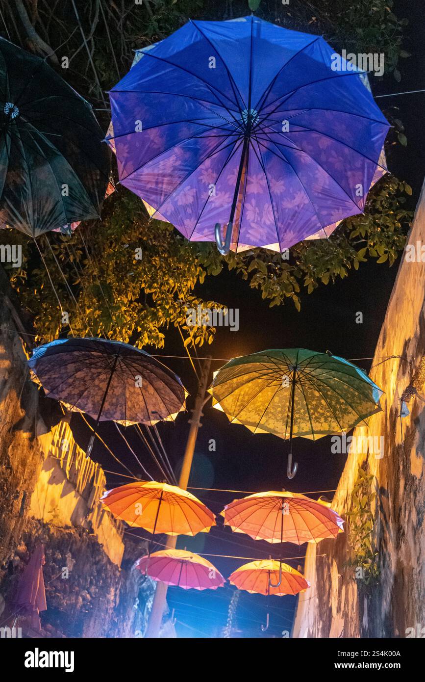 Color umbrellas hanging at an alley at Getsemaní Neigborhood. Cartagena ...