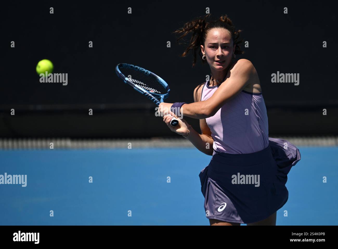 Zeyneo Sonmez of Turkey returns during her round 1 match against Talia ...