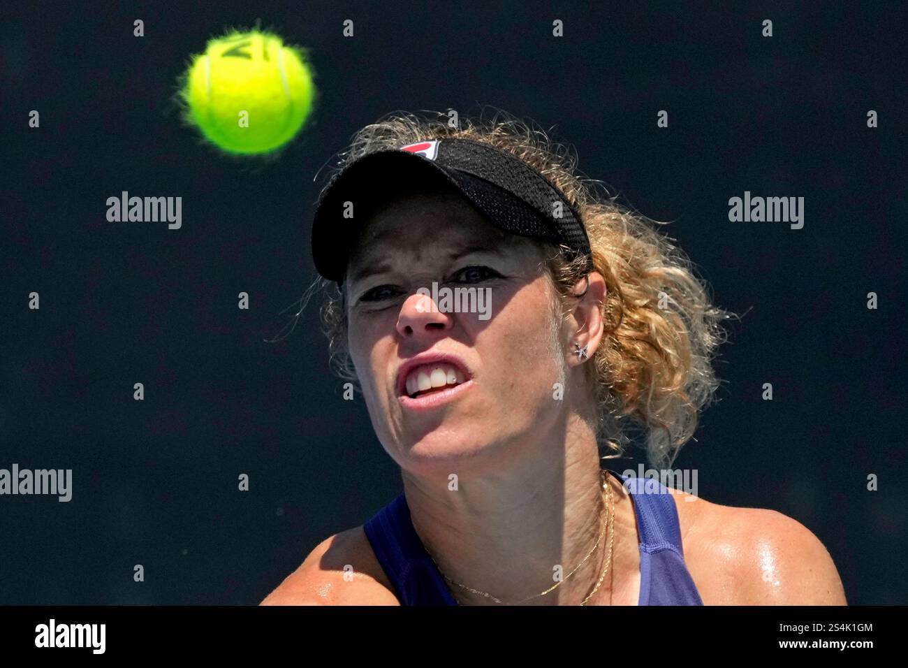 Laura Siegemund of Germany plays a forehand return to Hailey Baptiste ...