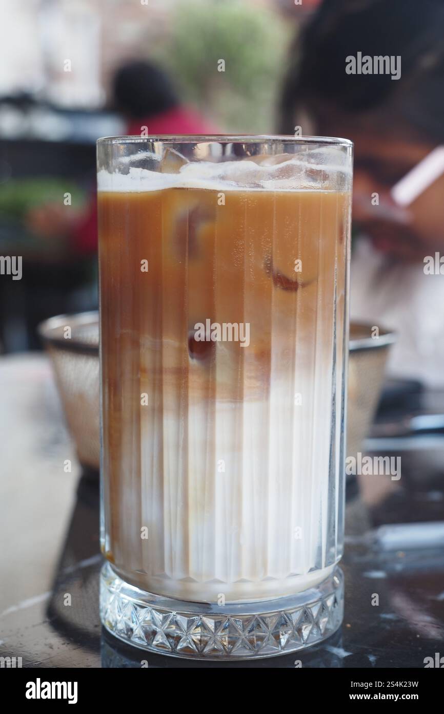 Enjoy a Refreshing Iced Coffee, complete with Ice Cubes in a Clear Glass for your delight Stock ...