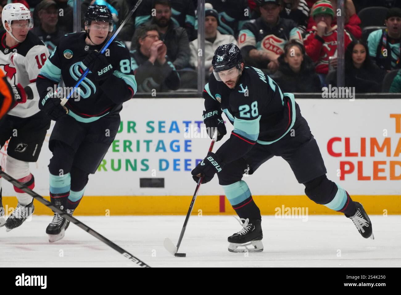 Seattle Kraken defenseman Joshua Mahura moves the puck against the New ...