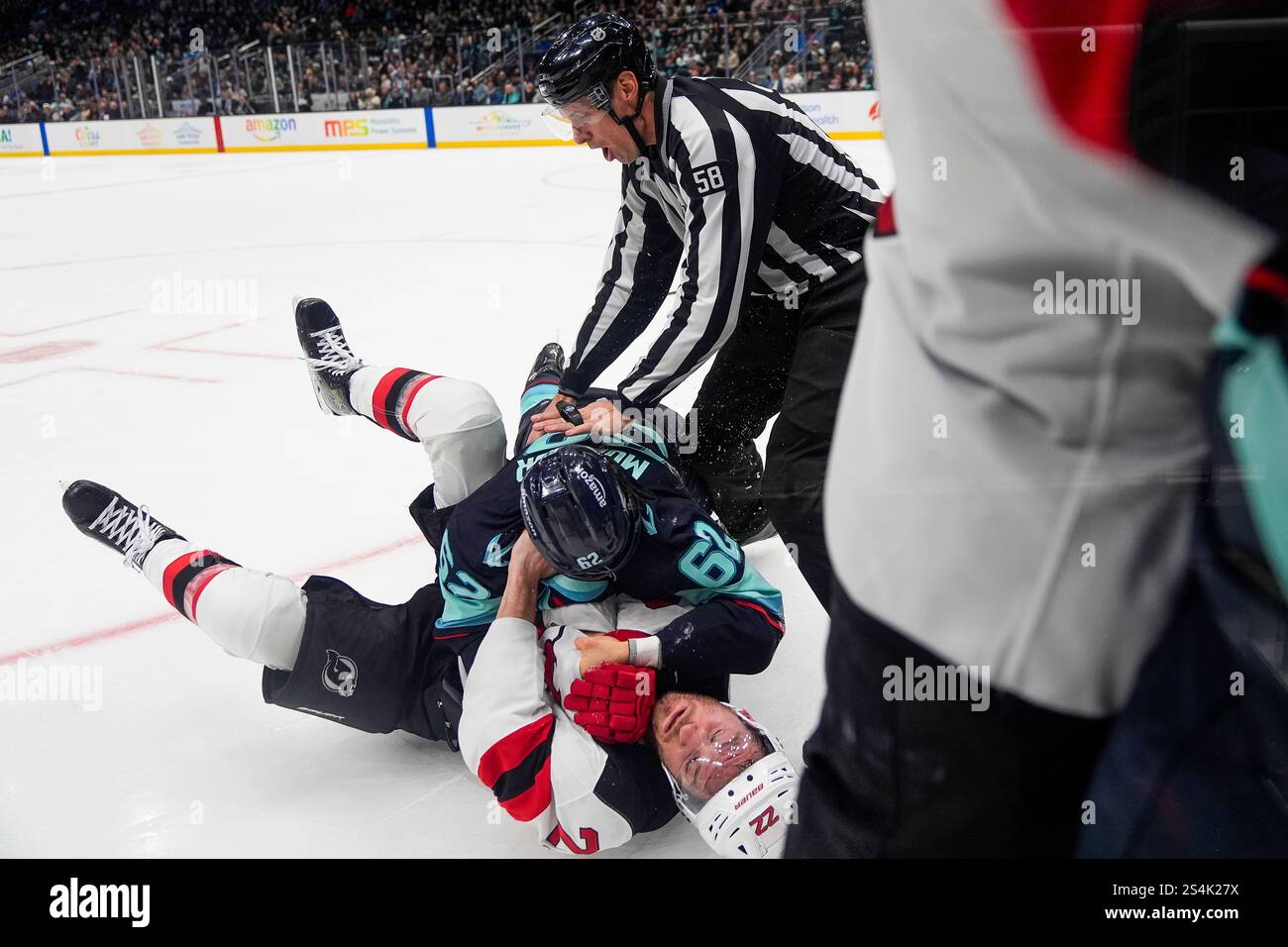 New Jersey Devils defenseman Brett Pesce (22) fights with Seattle ...