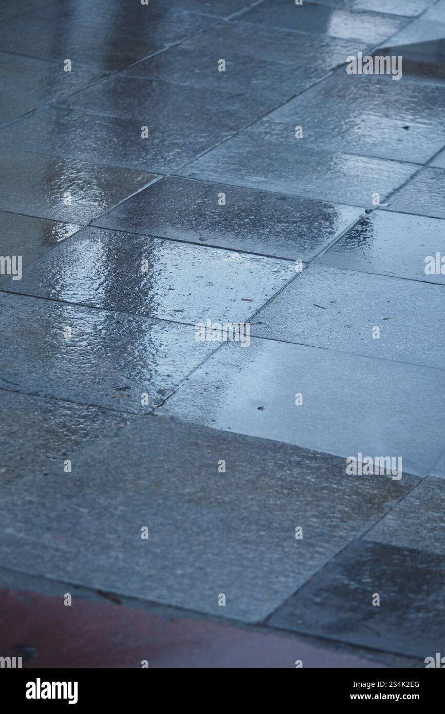 Wet tiles displaying reflections beautifully on a surface during rain ...