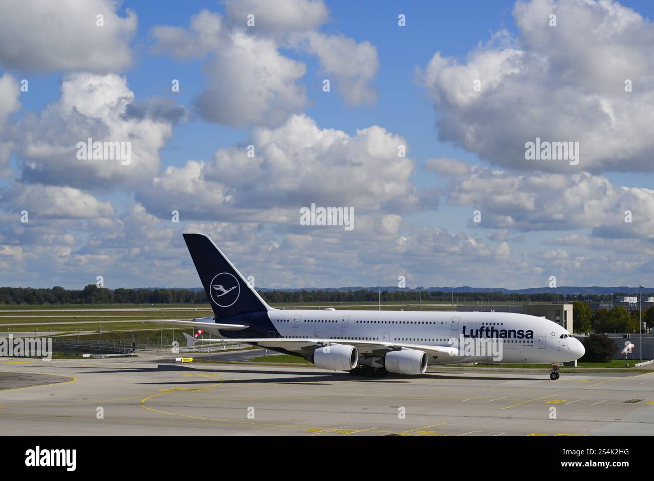 Lufthansa Airbus A380-800 taxiing under blue sky from Runway North on ...