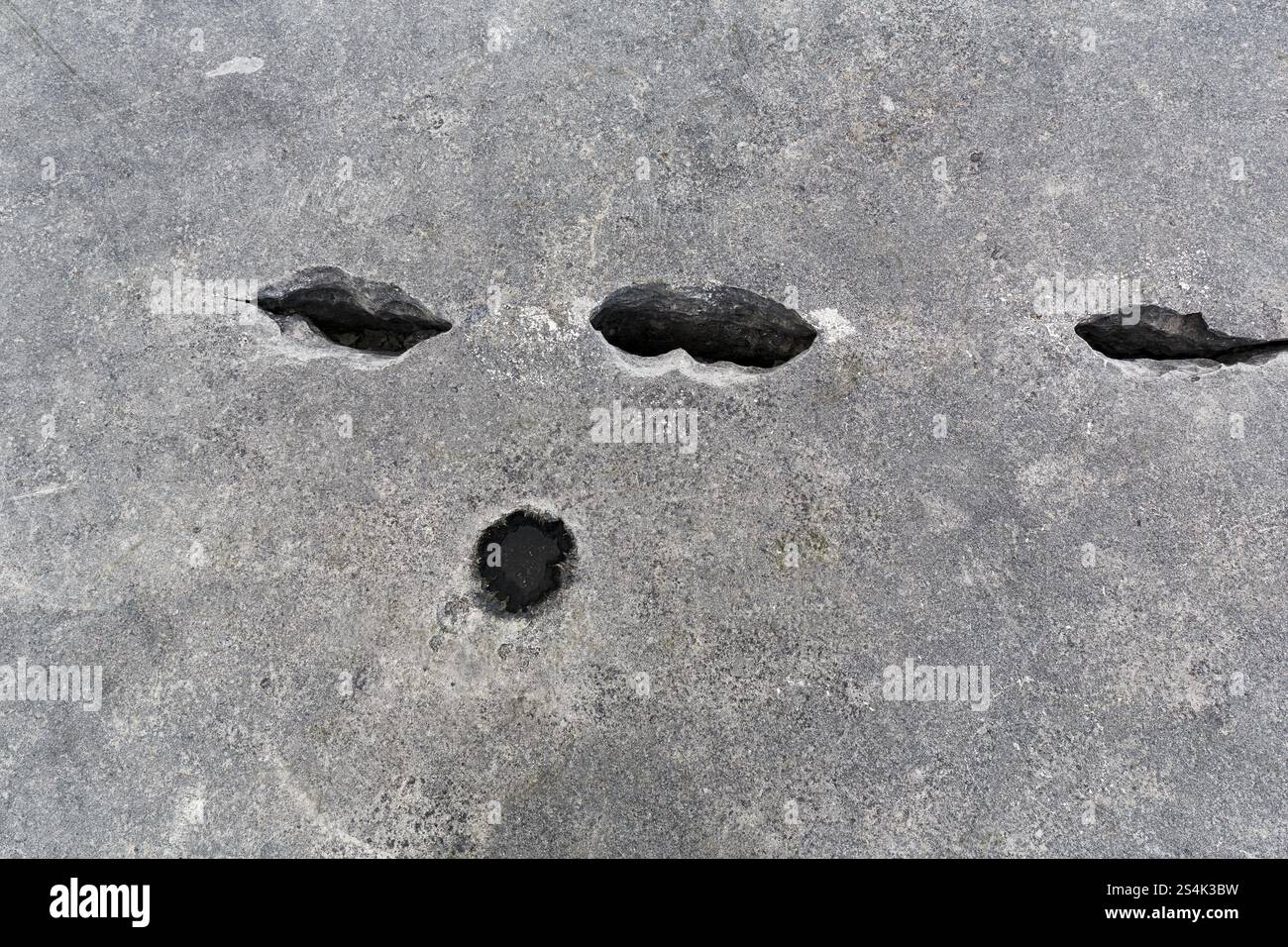 Surface of limestone slabs, holes, detal, view from above, full size ...