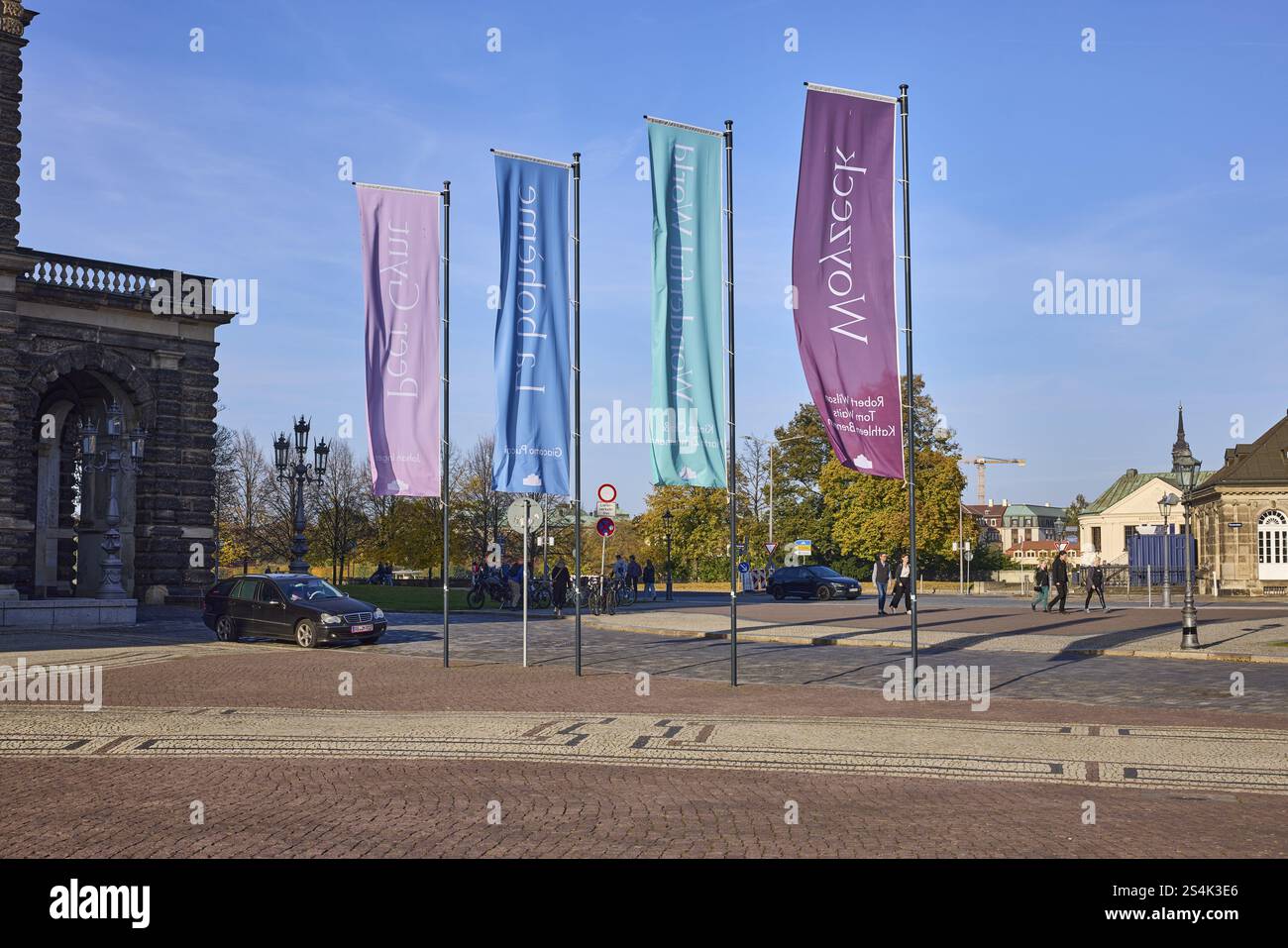 Flags with programme of the Dresden State Opera, blue sky, Theaterplatz ...