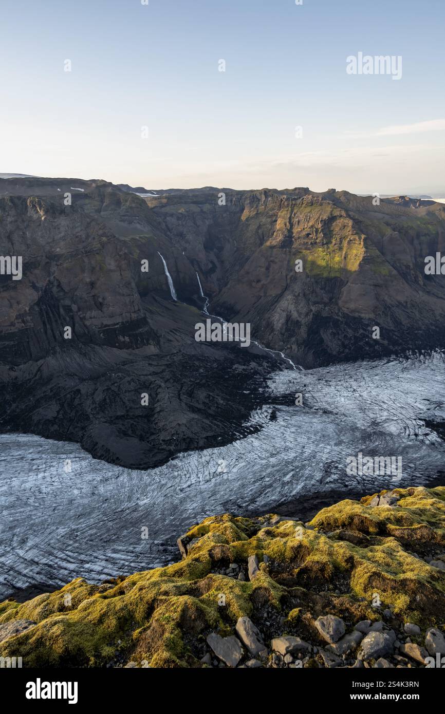 Waterfalls on a cliff, Impressive landscape with mountains and glaciers ...