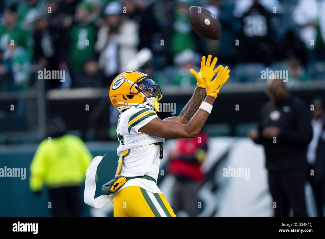 Green Bay Packers wide receiver Dontayvion Wicks (13) reaches for the ...