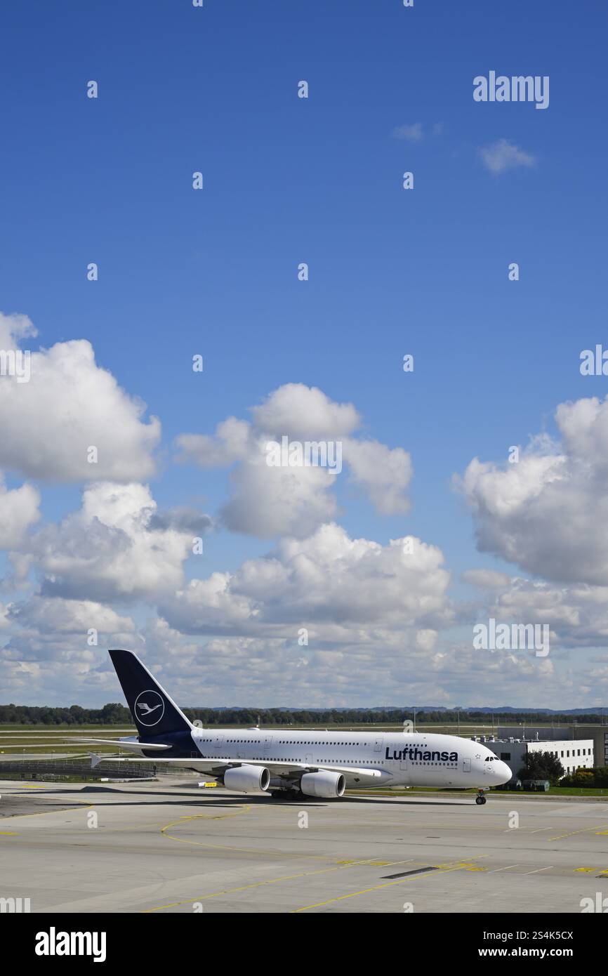 Lufthansa Airbus A380-800 taxiing under blue sky from Runway North on ...