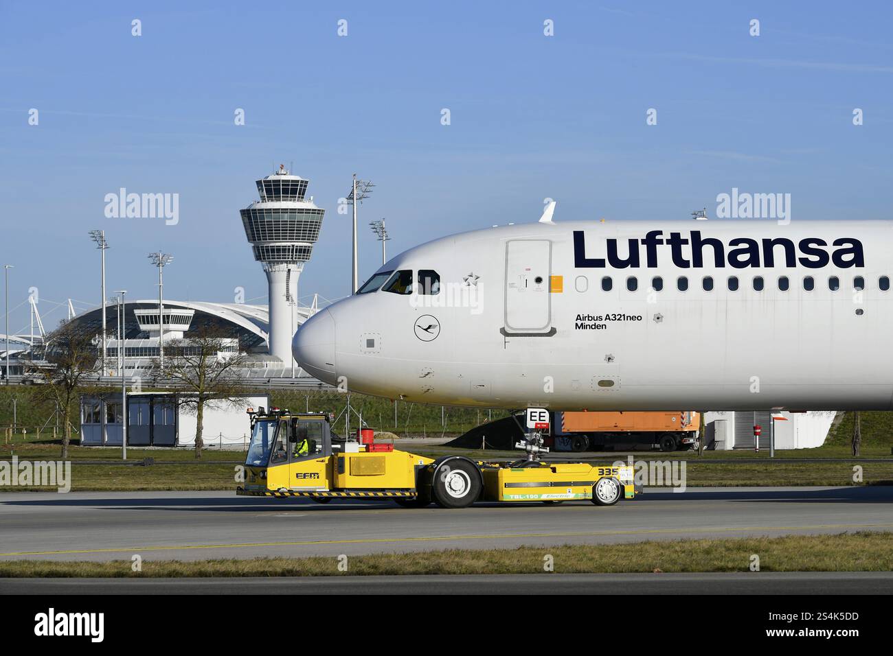 Lufthansa, Airbus A321neu being towed by towing vehicle with control ...