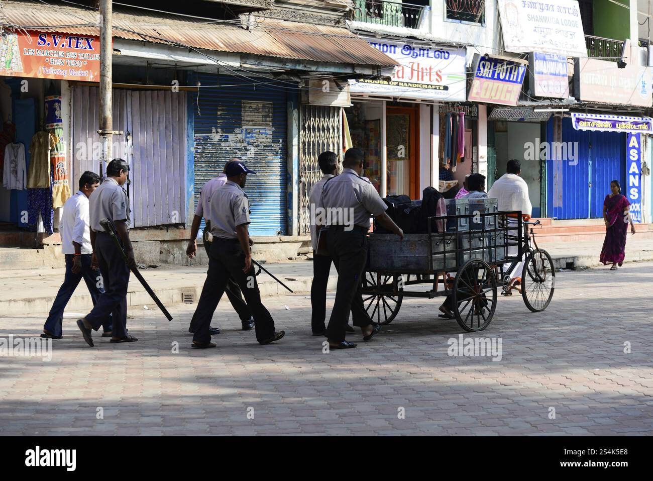 Cash transport, Madurai, South India, India, Asia, People pushing a ...