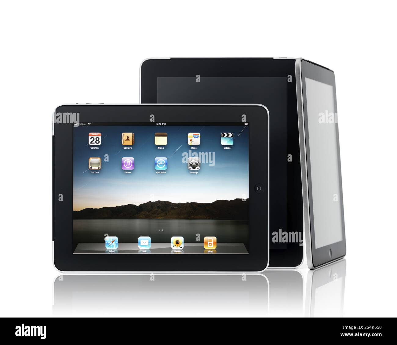 Three Apple iPad 3G tablet computers in a composition isolated on white ...