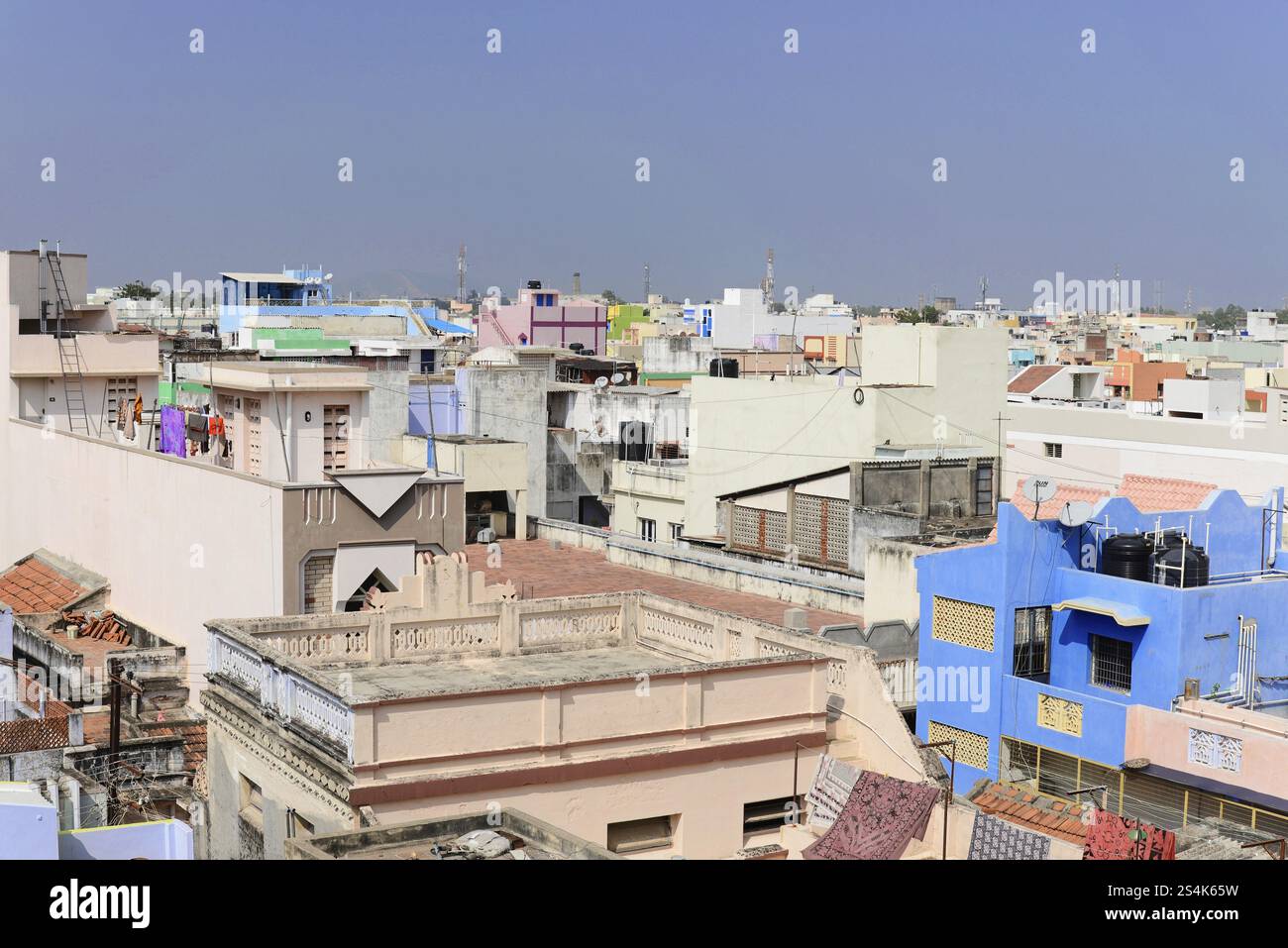 Diverse urban city view with colourful roofs and different building ...