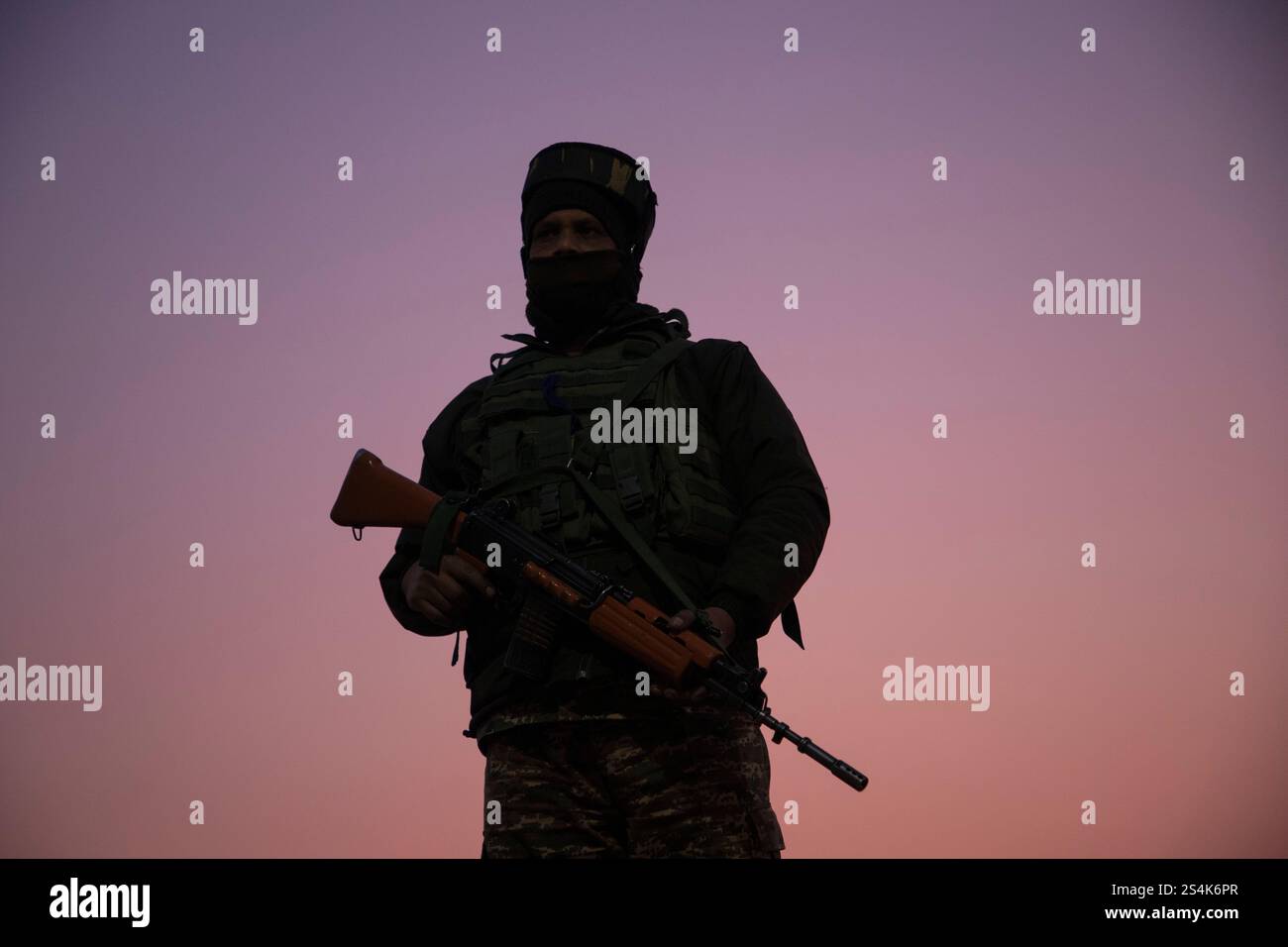 Indian paramilitary soldier stands alert along a road in Srinagar ahead ...