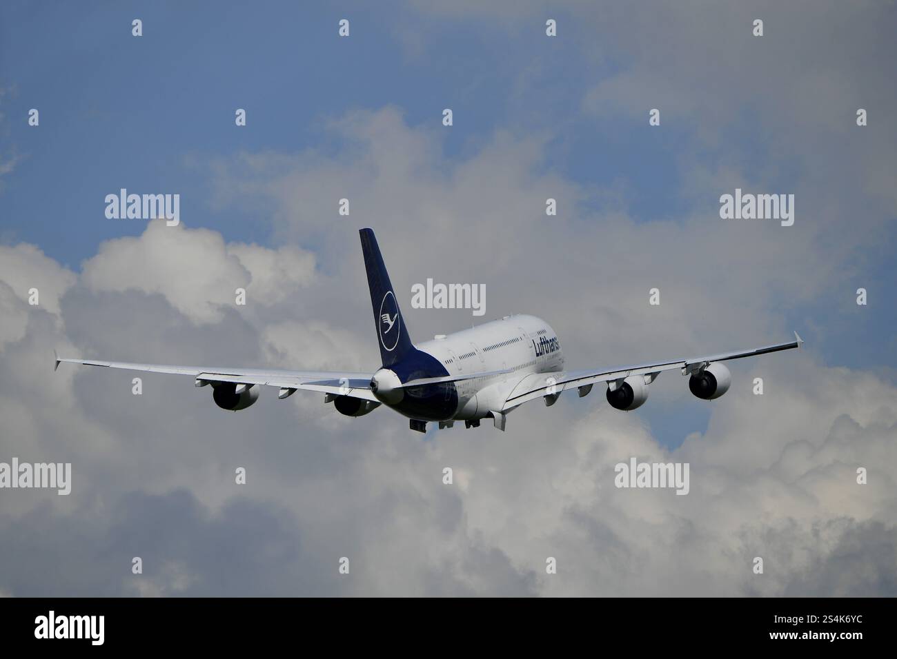 Lufthansa Airbus A380-800 taking off with blue sky and clouds, runway ...