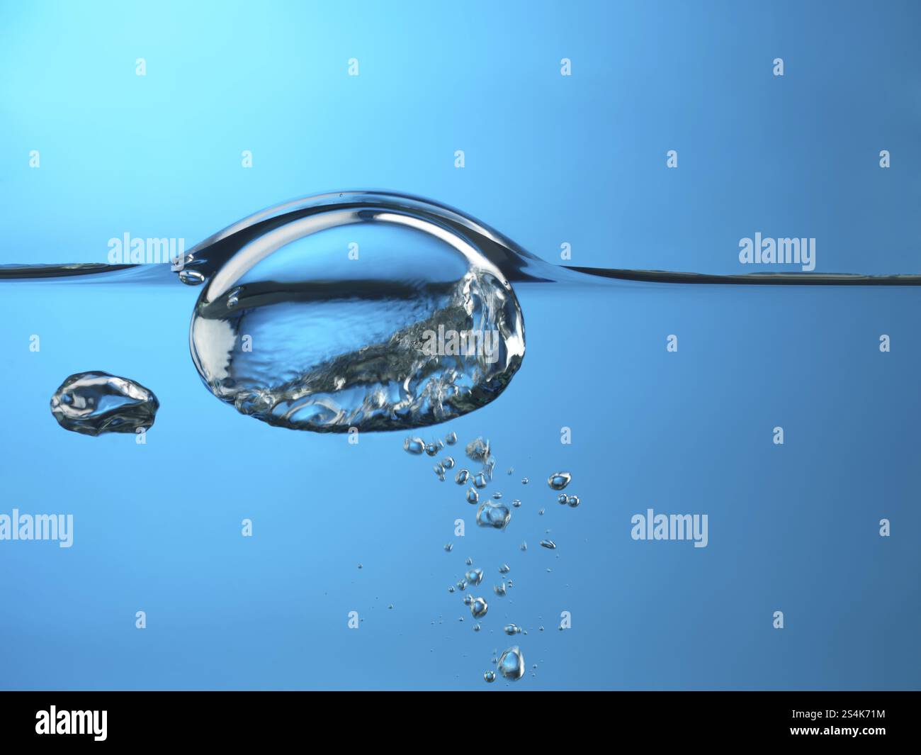 Oxygen bubble rising to the surface of water Stock Photo - Alamy
