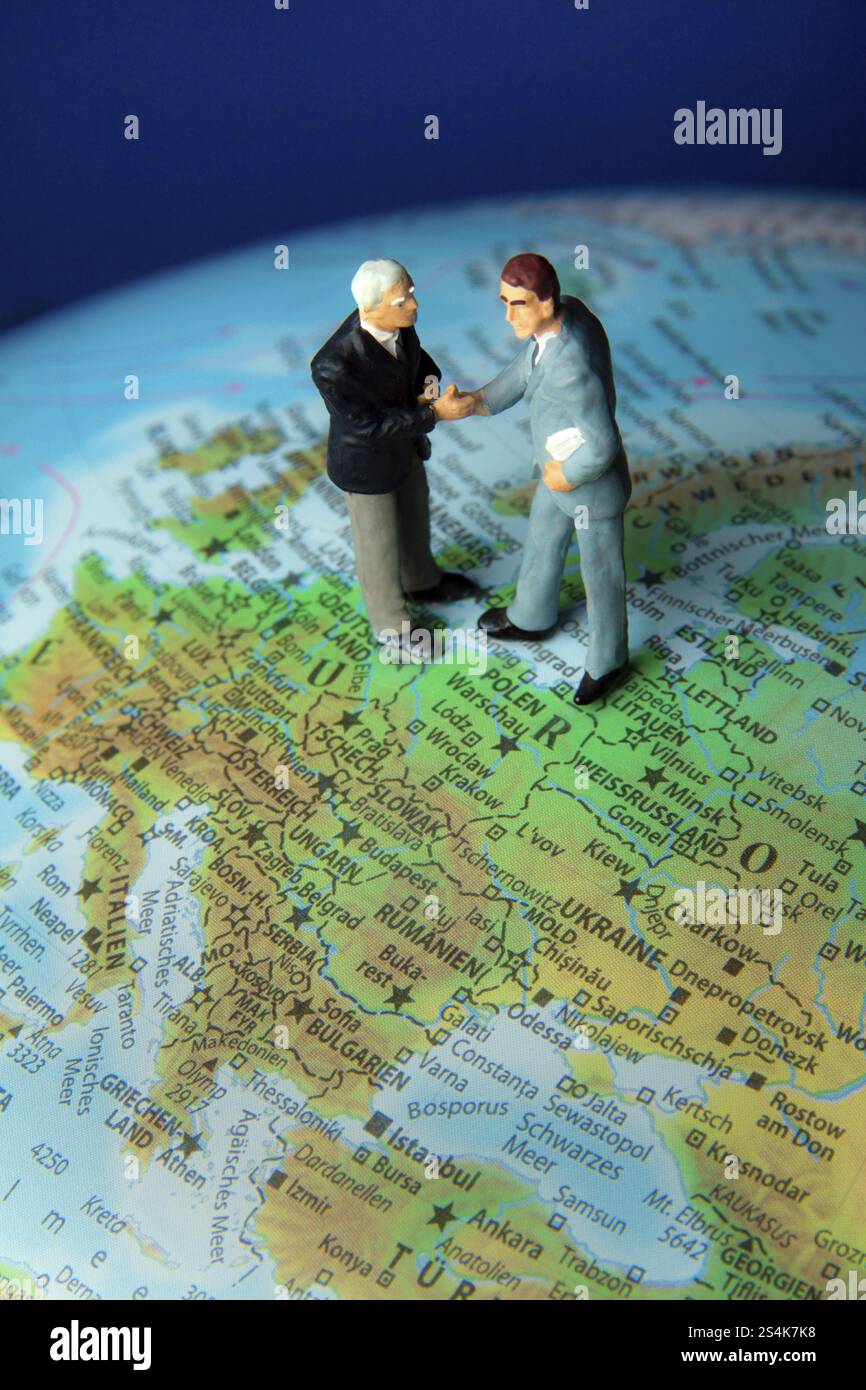 Two managers on one globe. Globalisation Stock Photo - Alamy