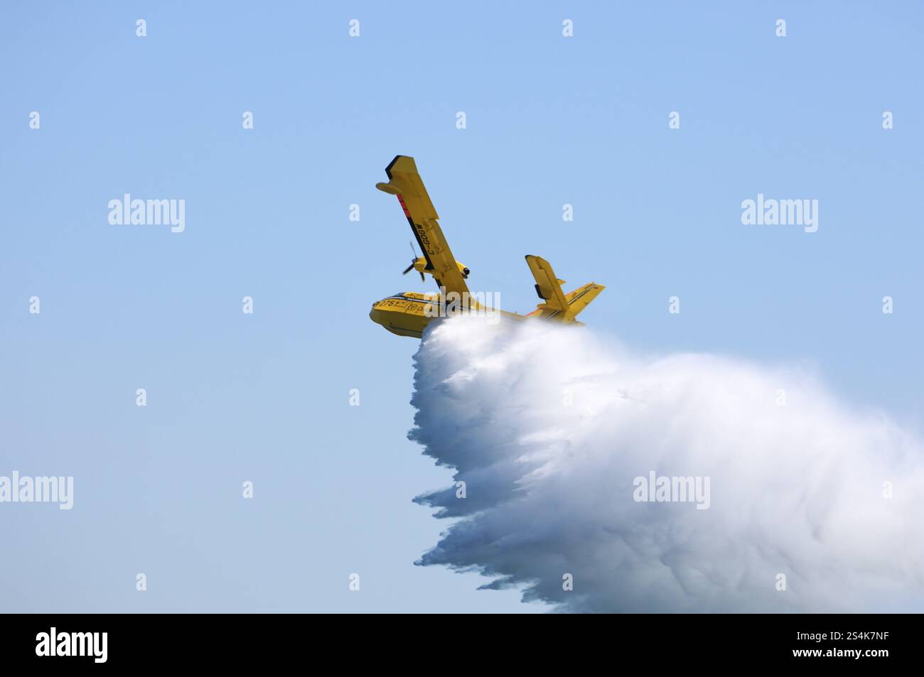 Water Bomber CL-415 firefighting amphibious aircraft releasing water at ...