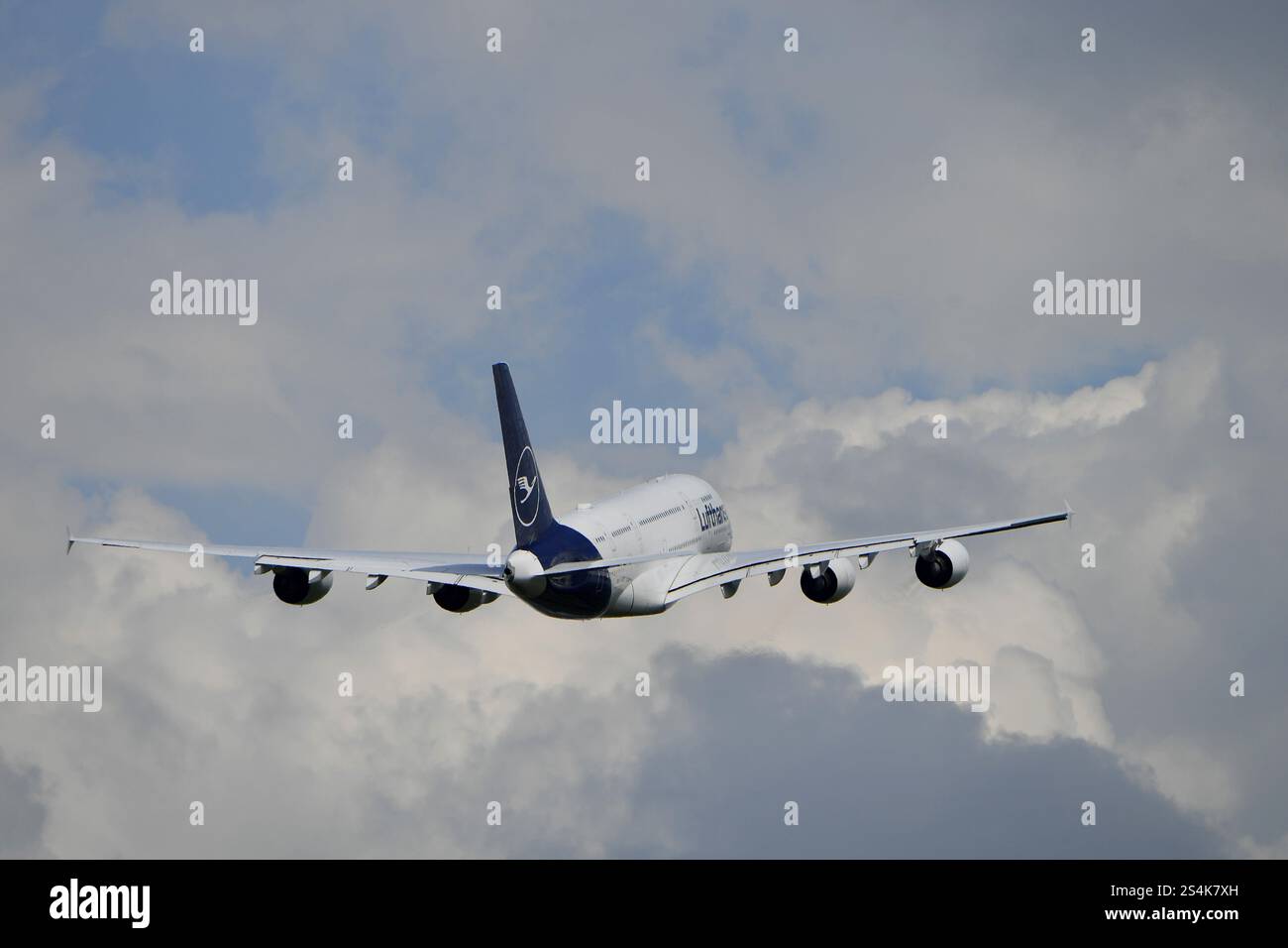 Lufthansa Airbus A380-800 taking off with blue sky and clouds, runway ...