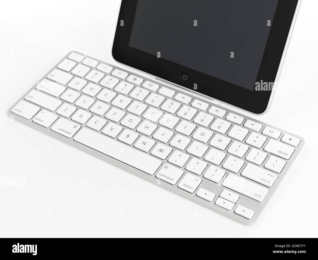 Apple iPad 3G tablet computer with a keyboard dock accessory isolated on white background Stock ...