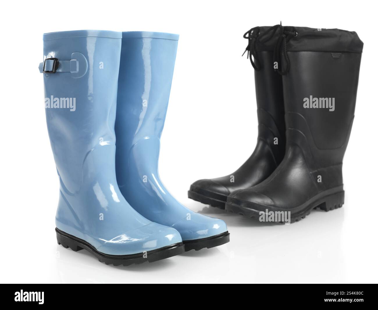 Two pairs of rubber boots isolated on white background Stock Photo - Alamy