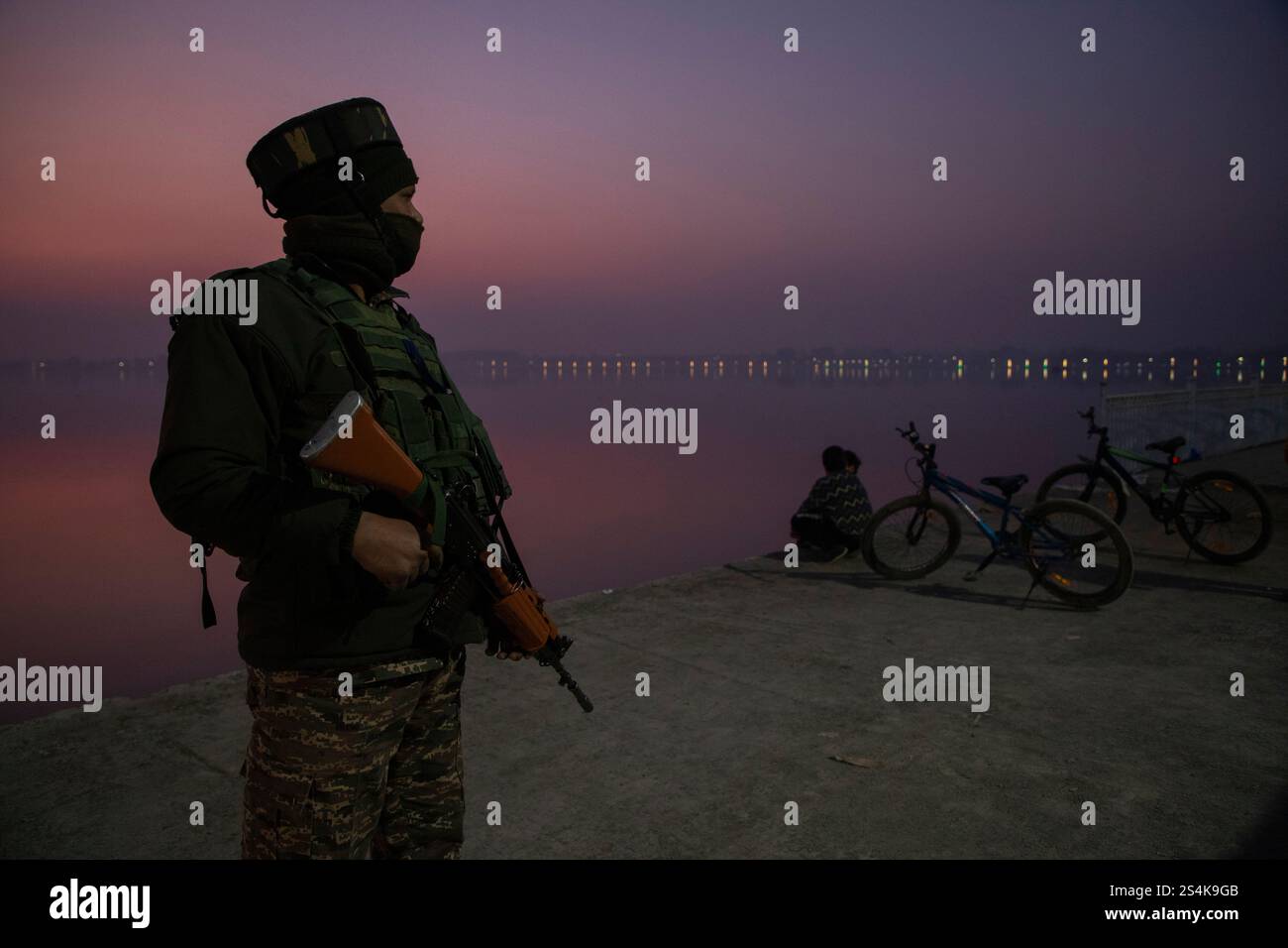 Indian paramilitary soldier stands alert along a road in Srinagar ahead ...