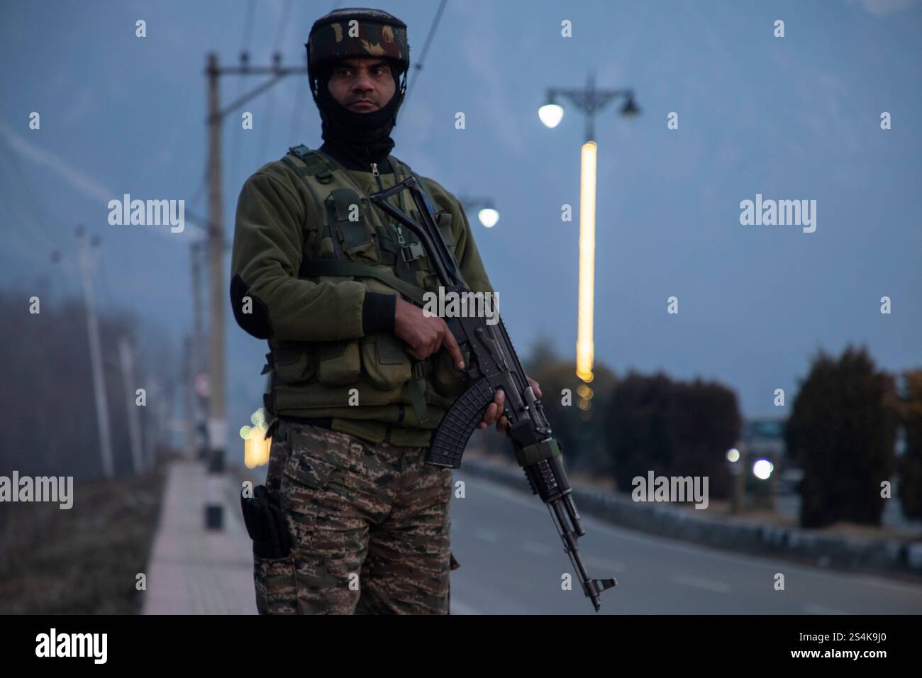 Indian paramilitary soldier stands alert along a road in Srinagar ahead ...