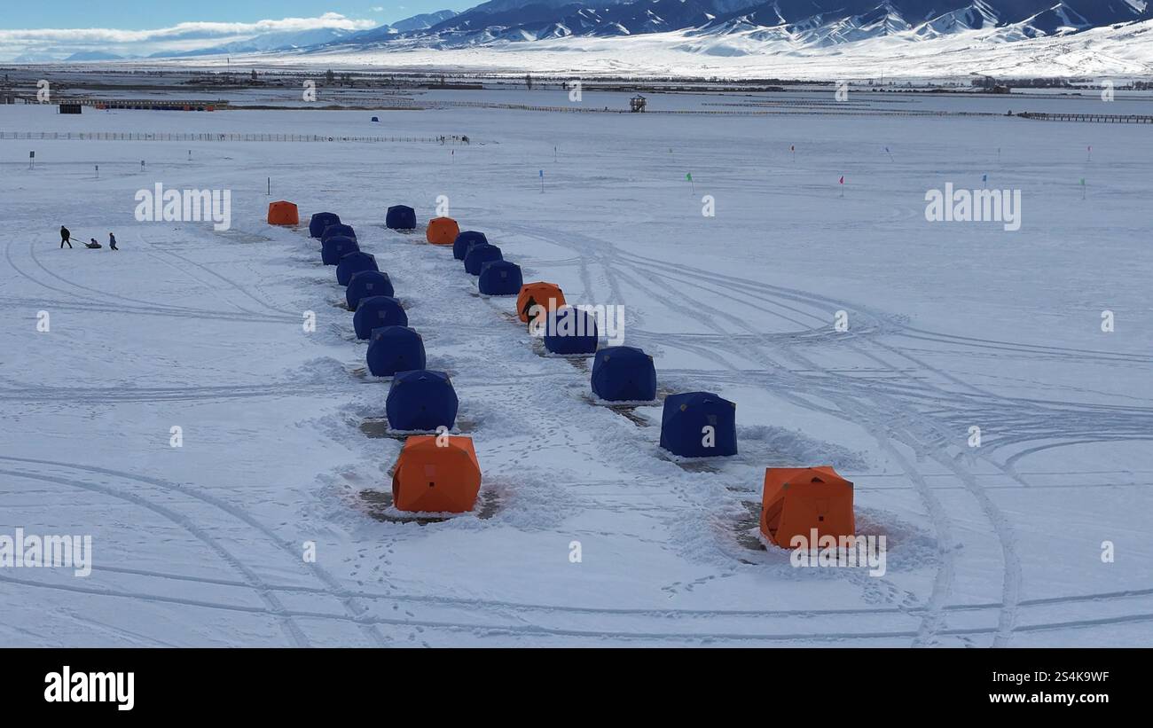 BARKOL, CHINA - JANUARY 12, 2025 - Camping tents are seen in a snowy ...