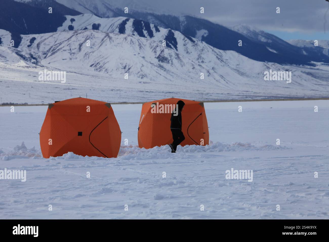 BARKOL, CHINA - JANUARY 12, 2025 - Camping tents are seen in a snowy ...