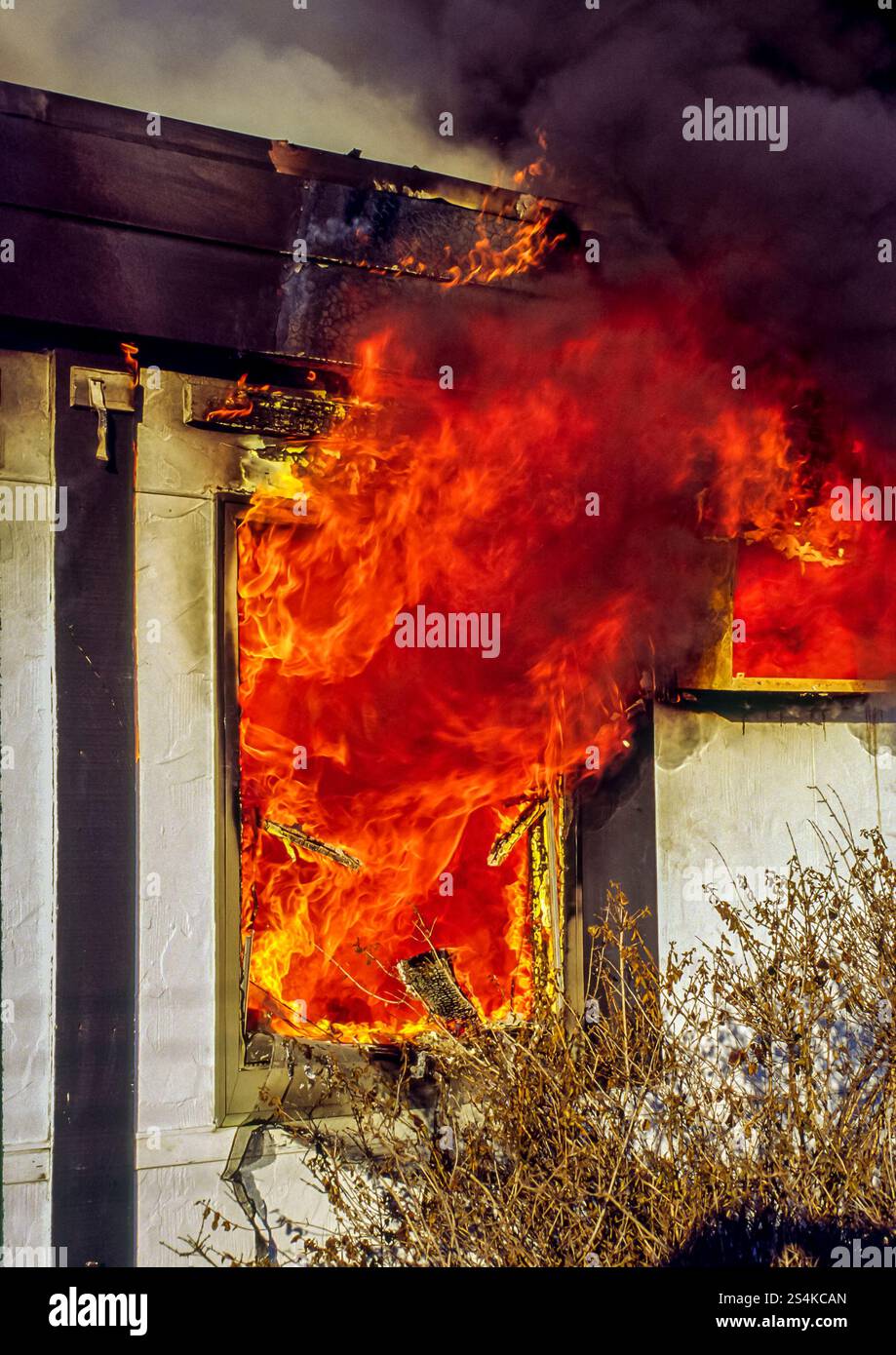 Minnesota. House on fire. Intense fire coming through the window of a ...