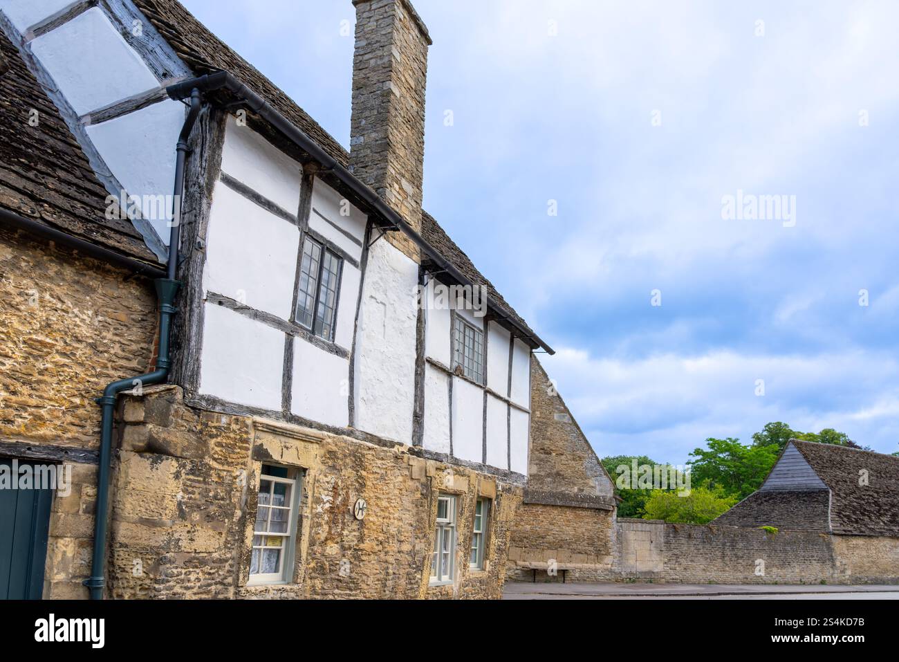Heritage medieval building of stone and half-timber with slate roof in ...