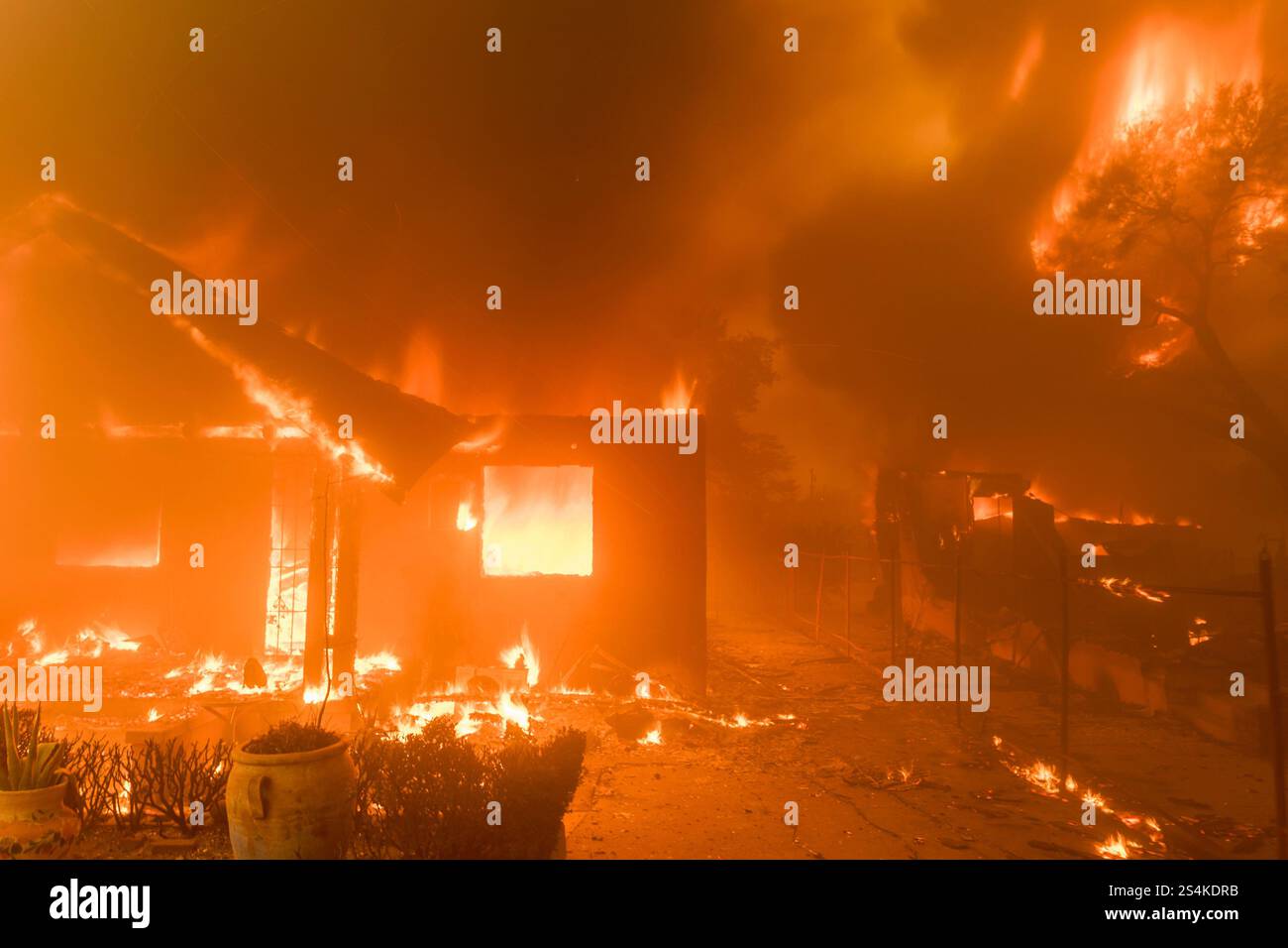 A home burns in the Eaton Fire in Altadena, Calif., Wednesday, Jan. 8 ...