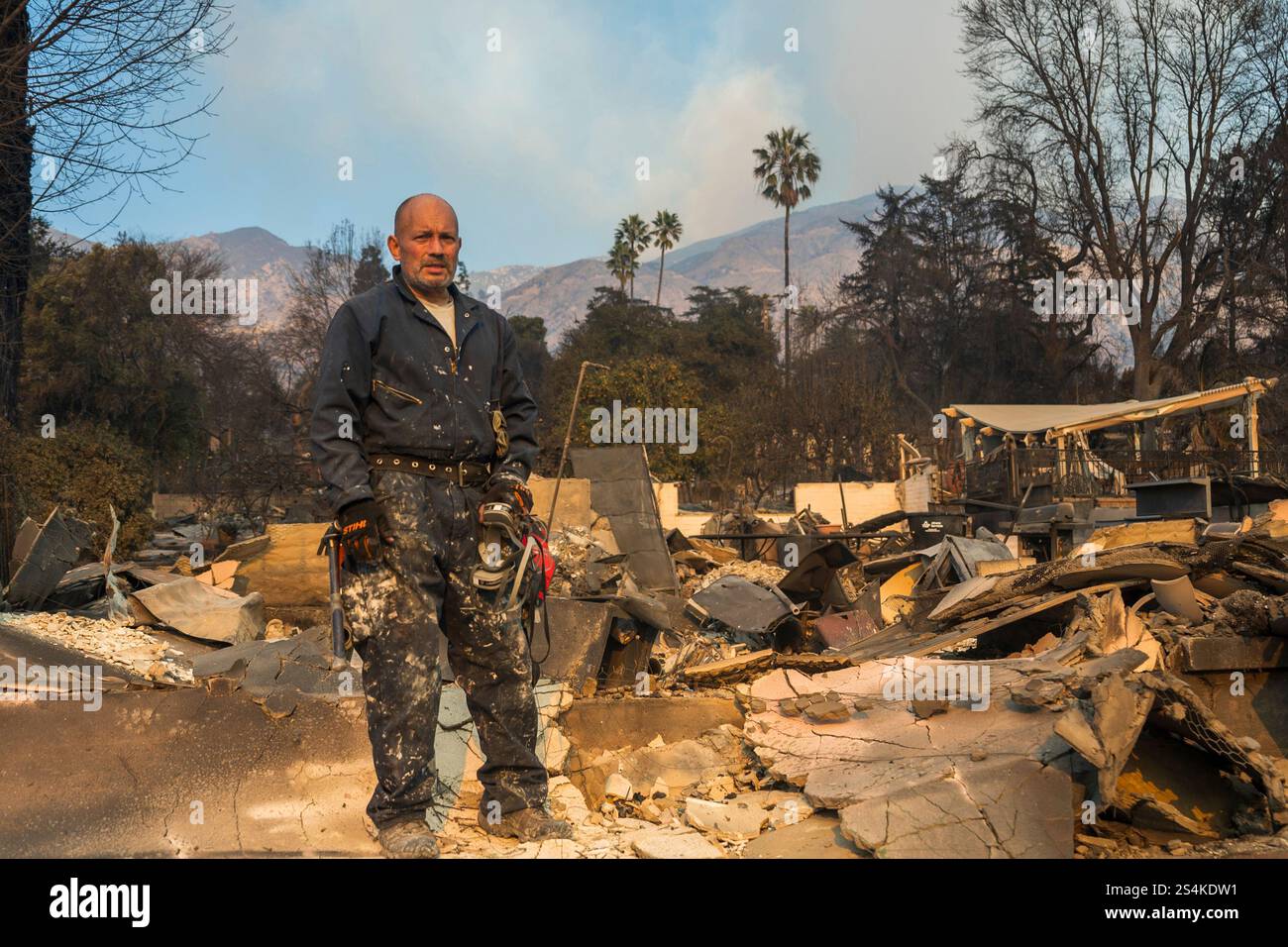 Cesar Plaza looks over the remains of his house that destroyed in the ...