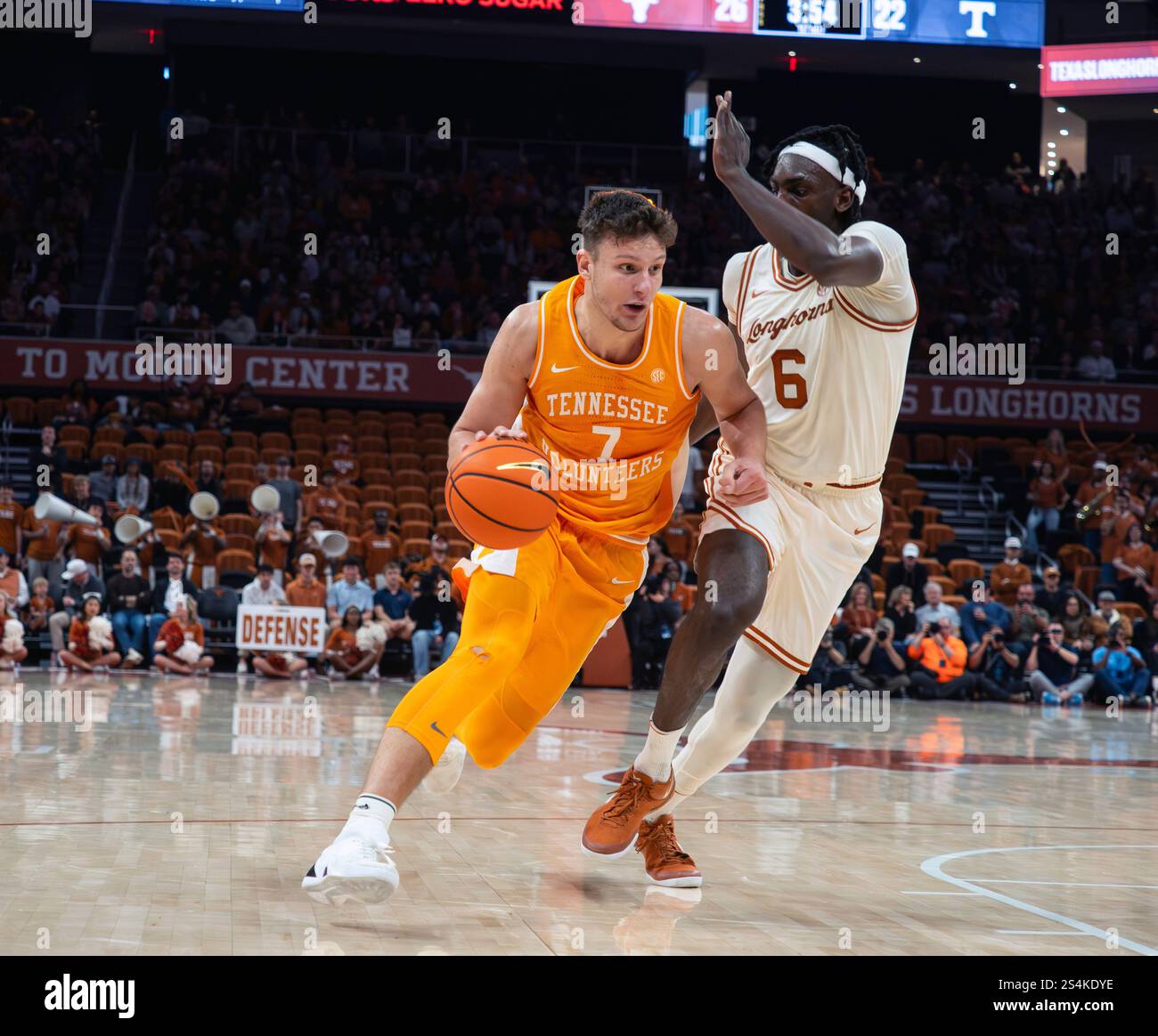 Tennessee forward Igor Milicic Jr (7) drives the ball against Texas forward Arthur Kaluma (6 ...