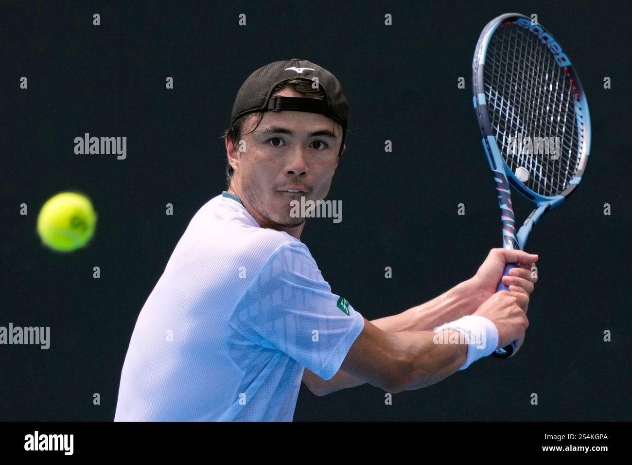 Taro Daniel of Japan plays a backhand return to Tristan Schoolkate of ...