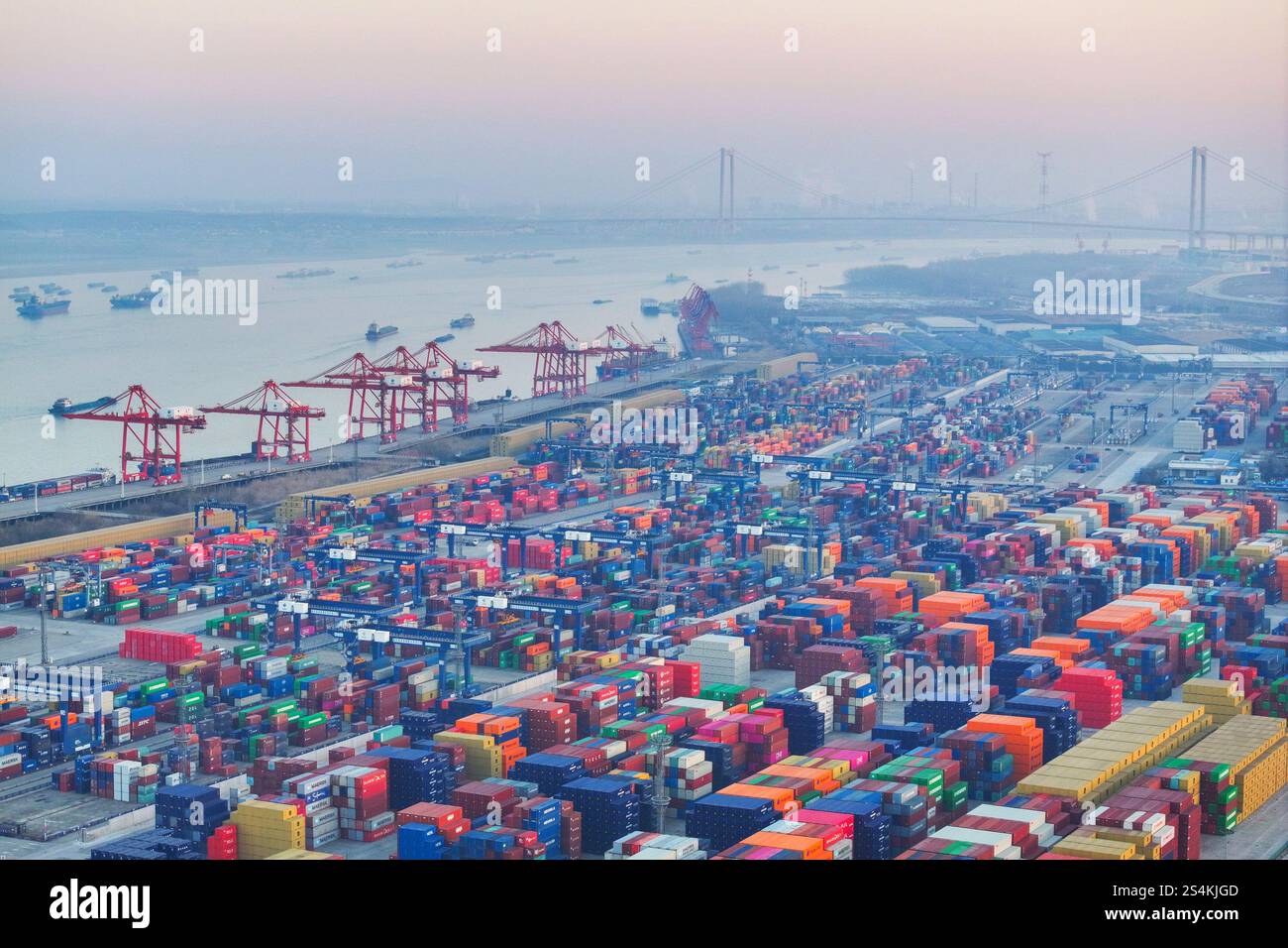 Cargo ships are docked for loading and unloading operations at the ...