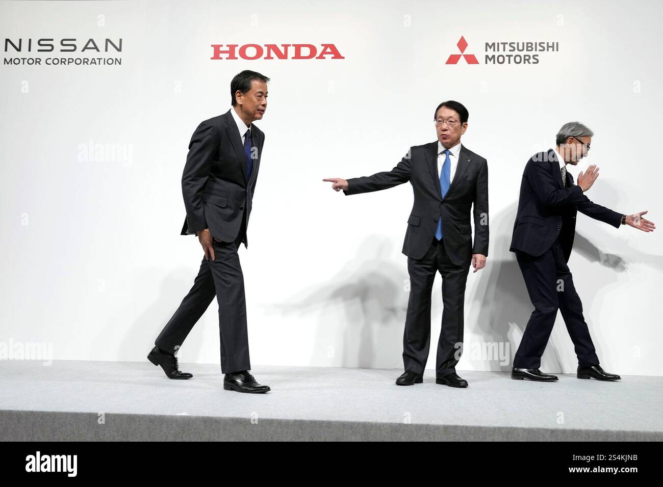 FILE - Nissan Chief Executive Makoto Uchida, left, Takao Kato, CEO of ...