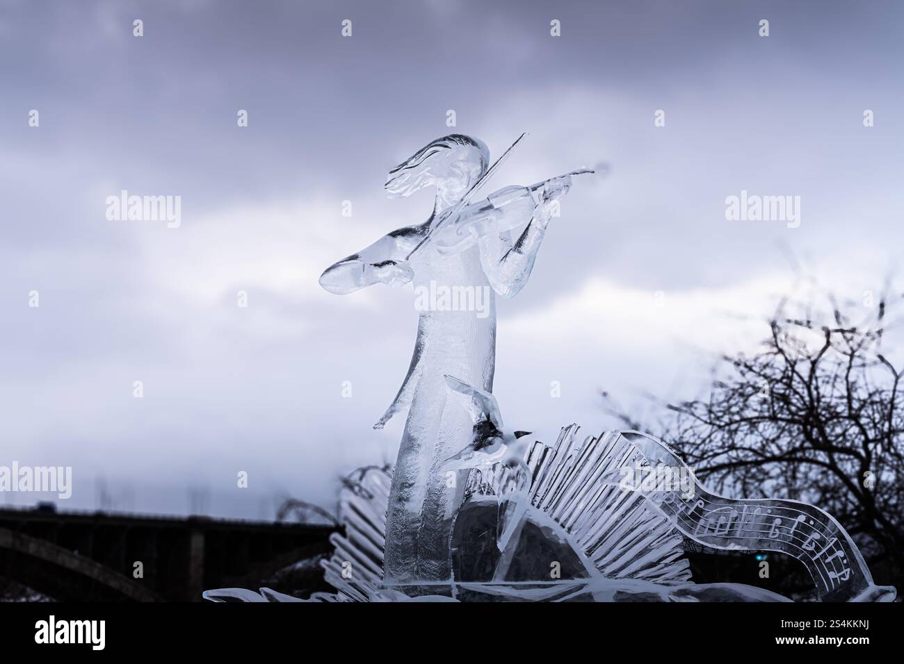 The ice woman violinist is a fragment of a street sculpture made of ice ...