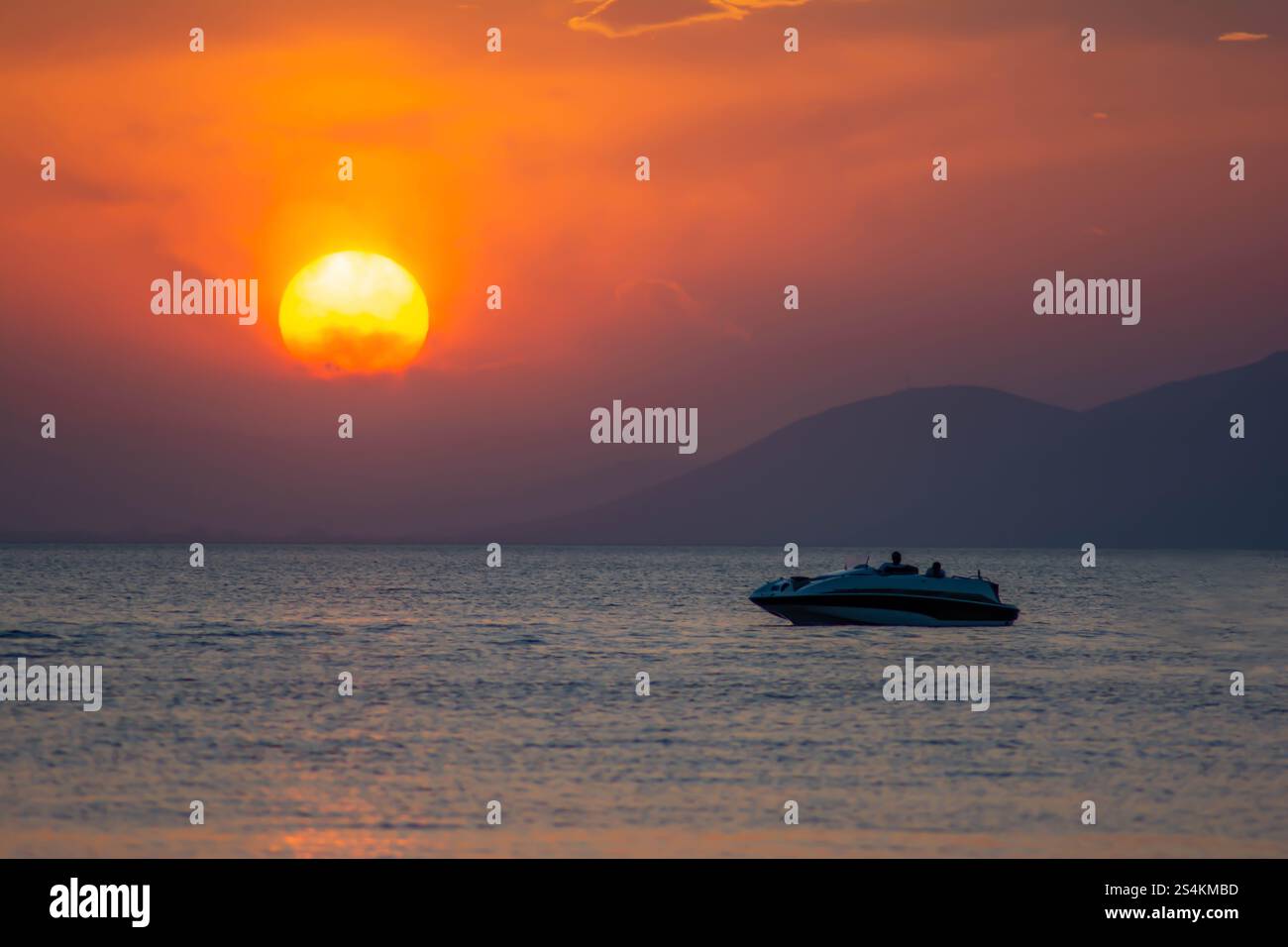 Ship and golden sun over the sea. Fantastic sunset over the sea. Orange ...