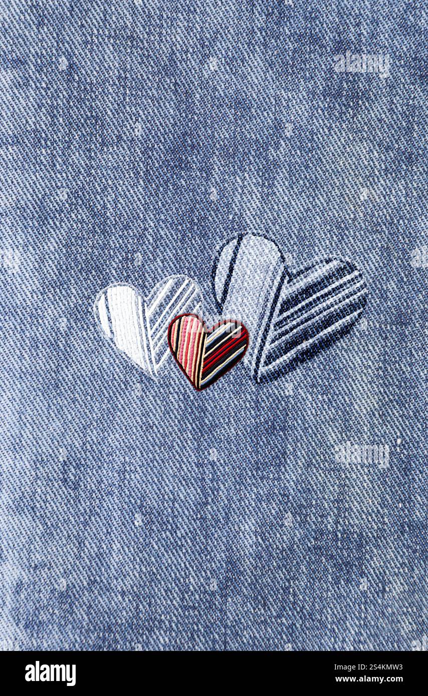 Light blue denim background with felt heart. Vertical blue color denim ...