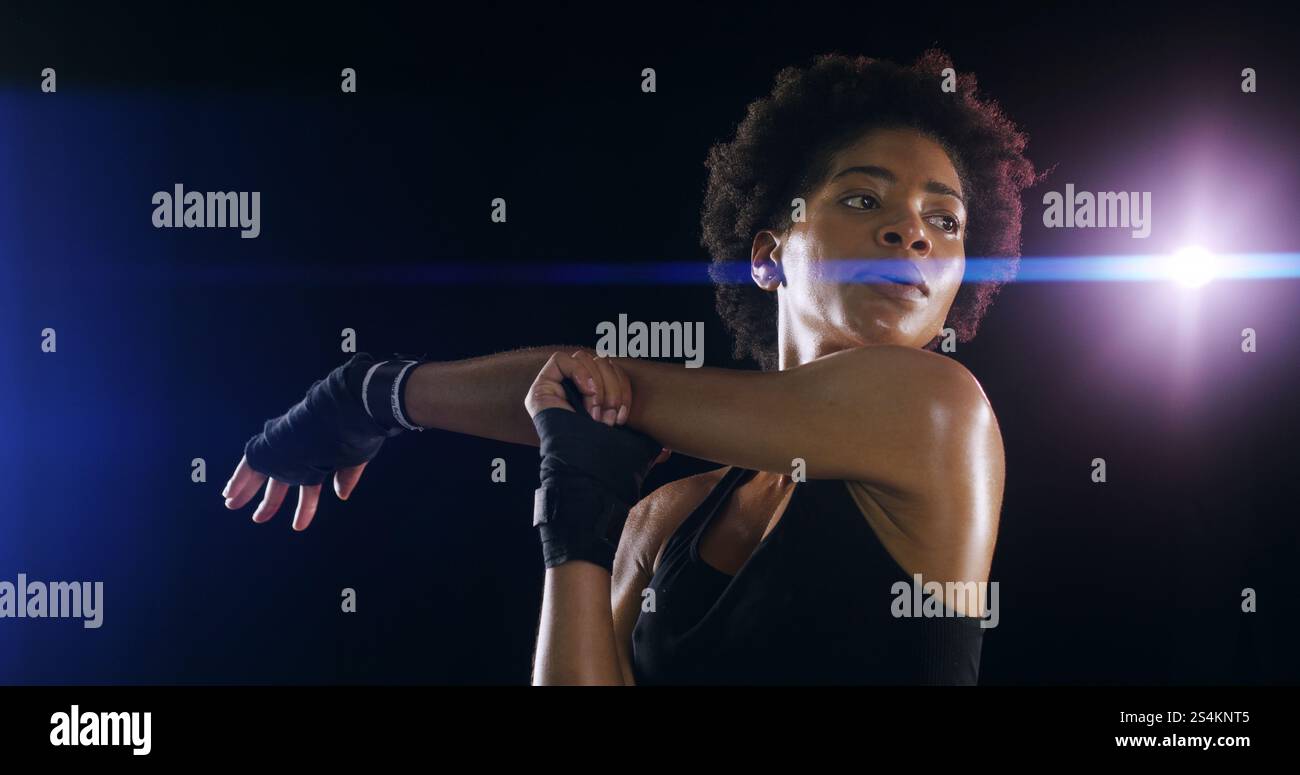 Woman, stretching arms and martial arts in studio with workout ...