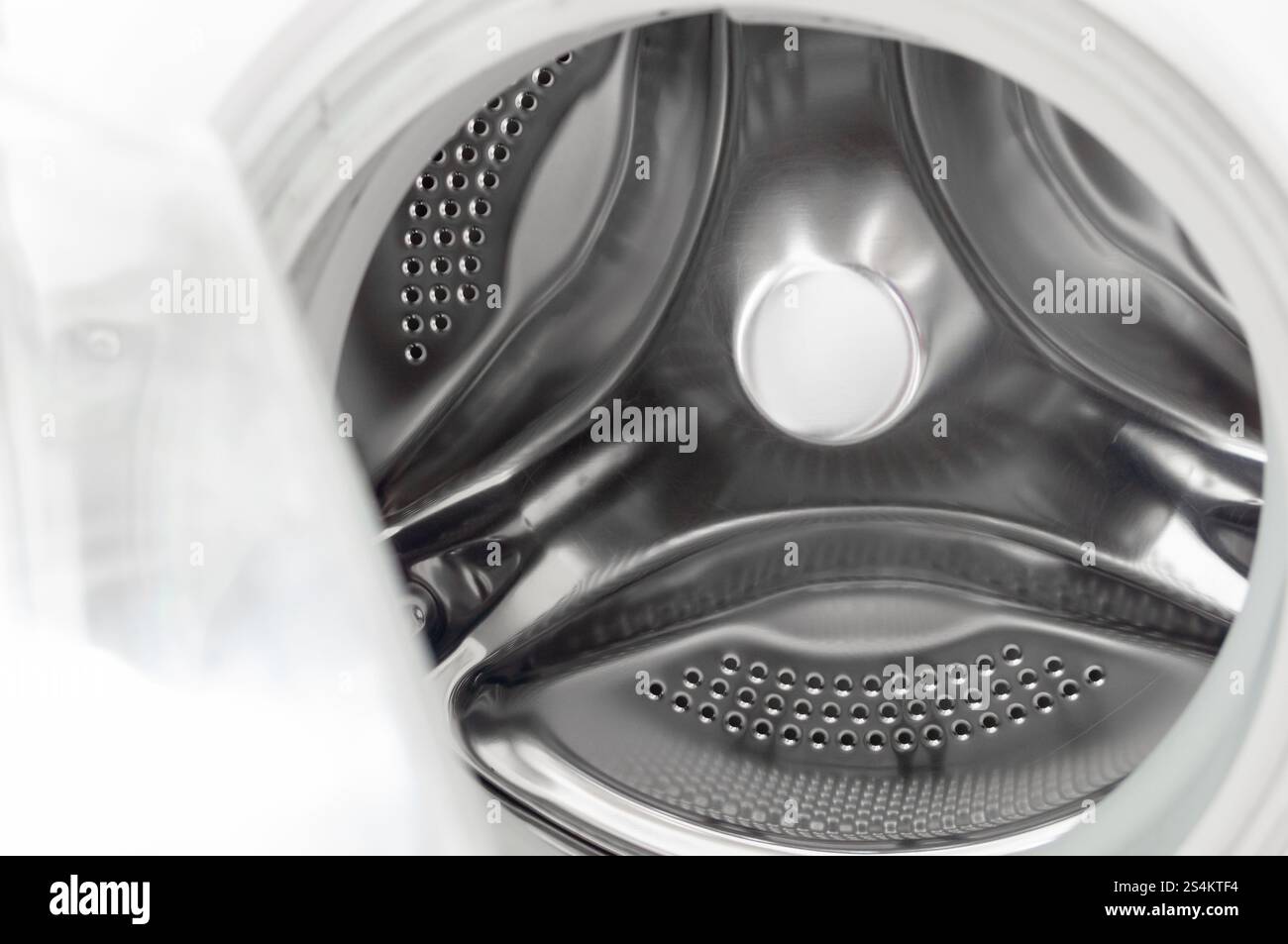 Washing machine drum close up. Inside the washing machine. Metal ...