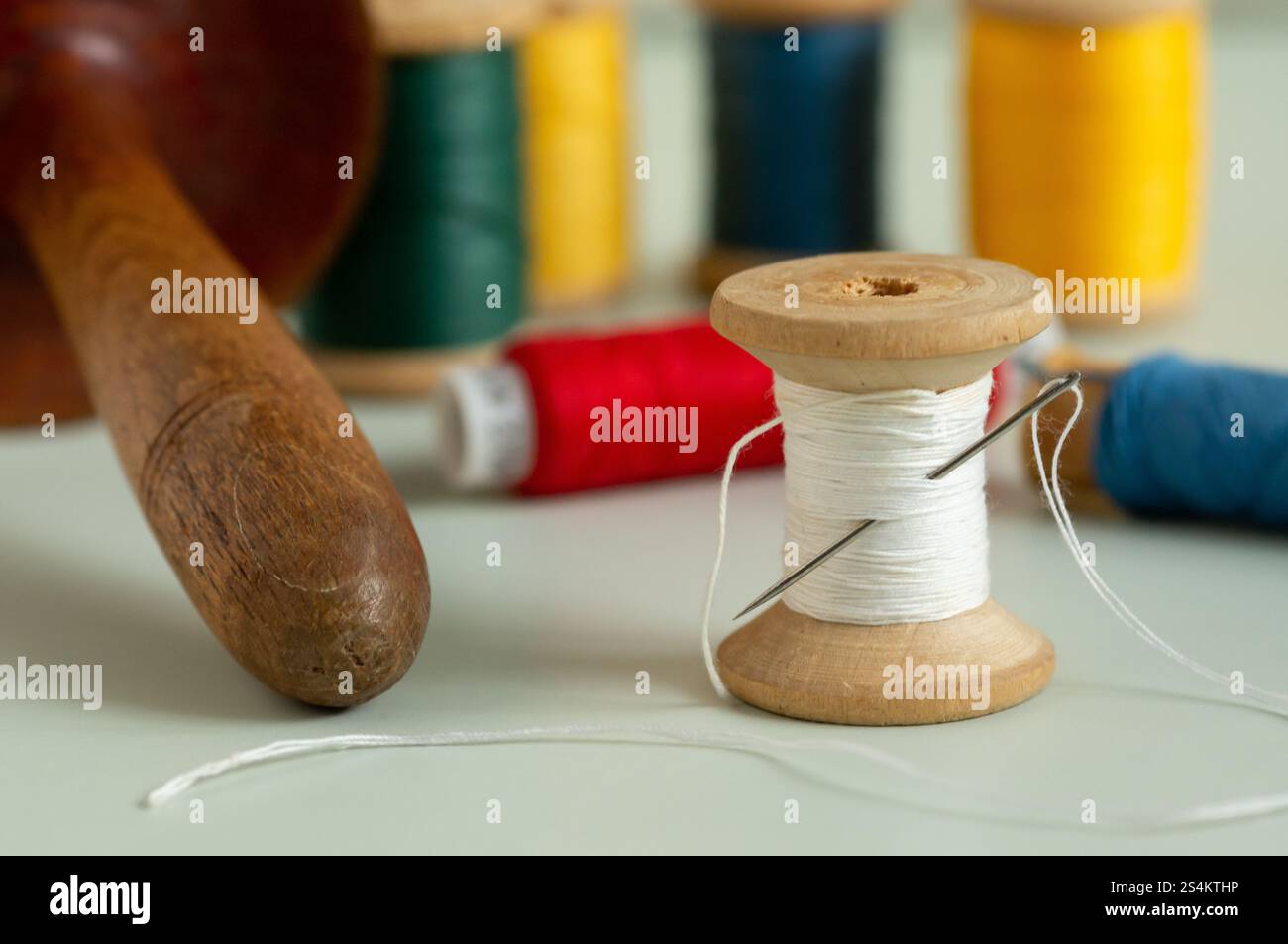 Real old spools of needle and thread meter close-up Stock Photo - Alamy