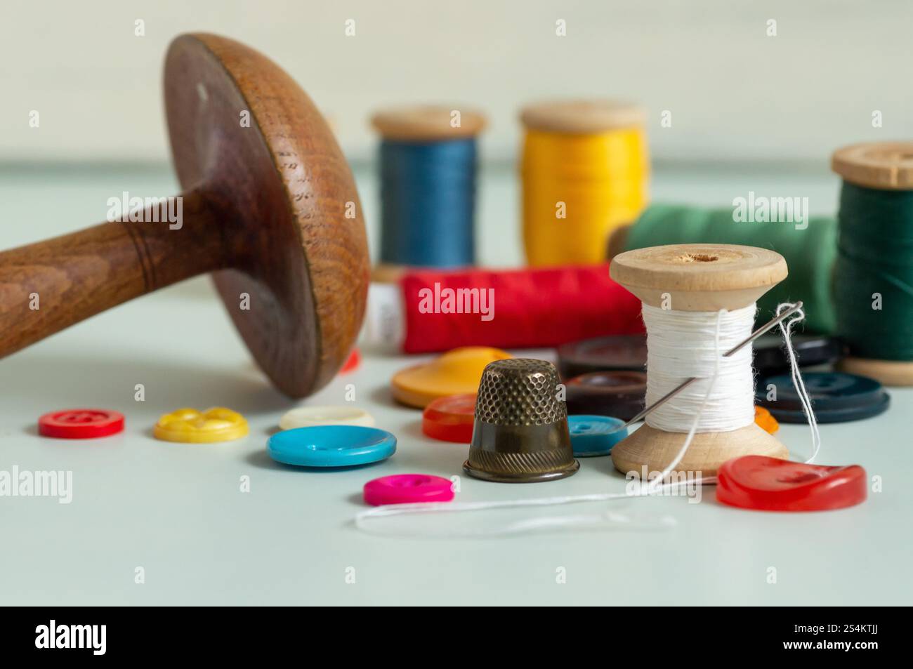 Sewing items - thimble, needle, measuring tape, spools of thread Stock ...