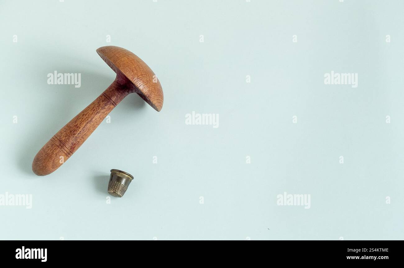 An old thimble on a white background, a wooden sewing machine Stock ...