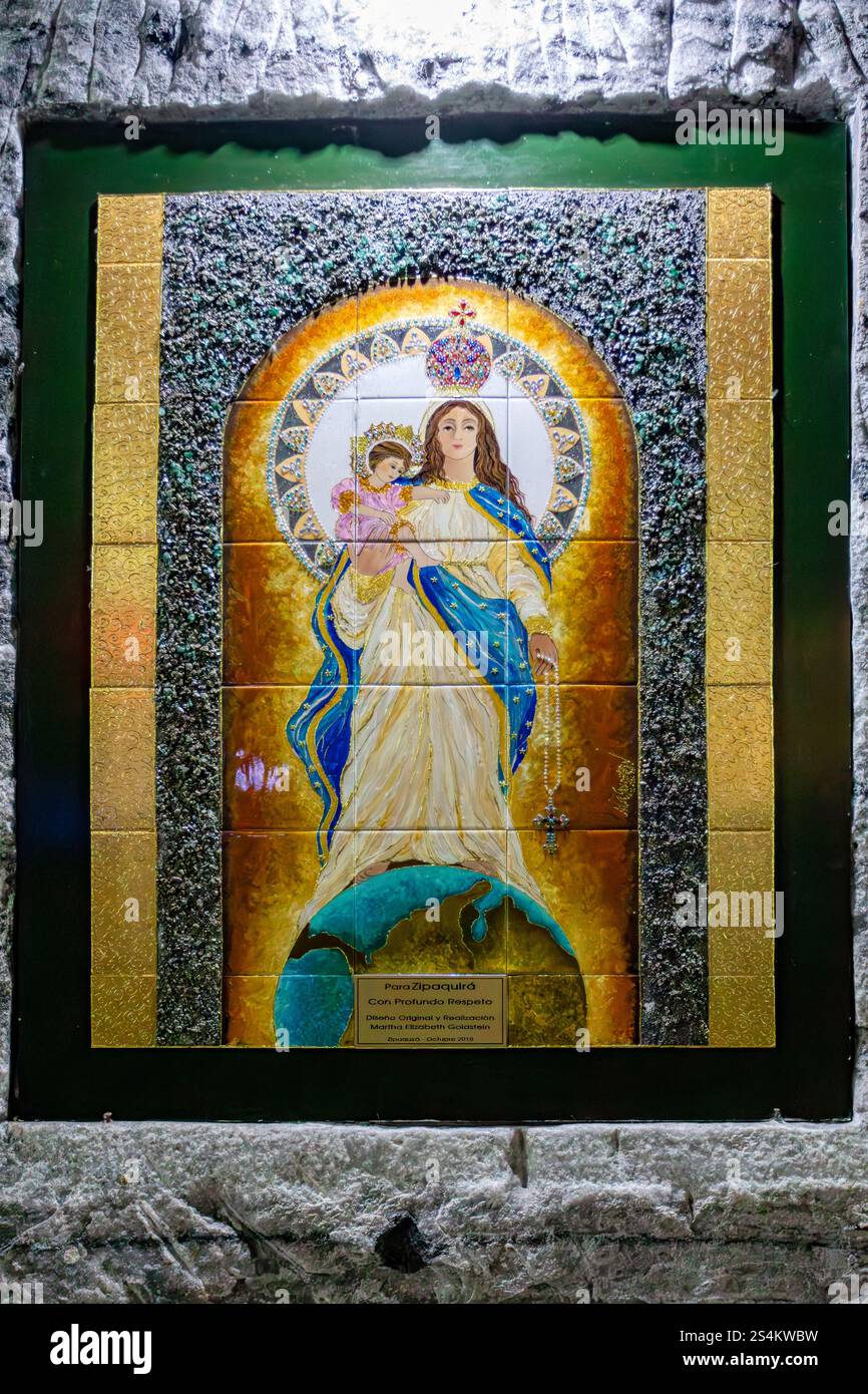 Religious artwork of the Virgin Mary displayed on the textured stone ...