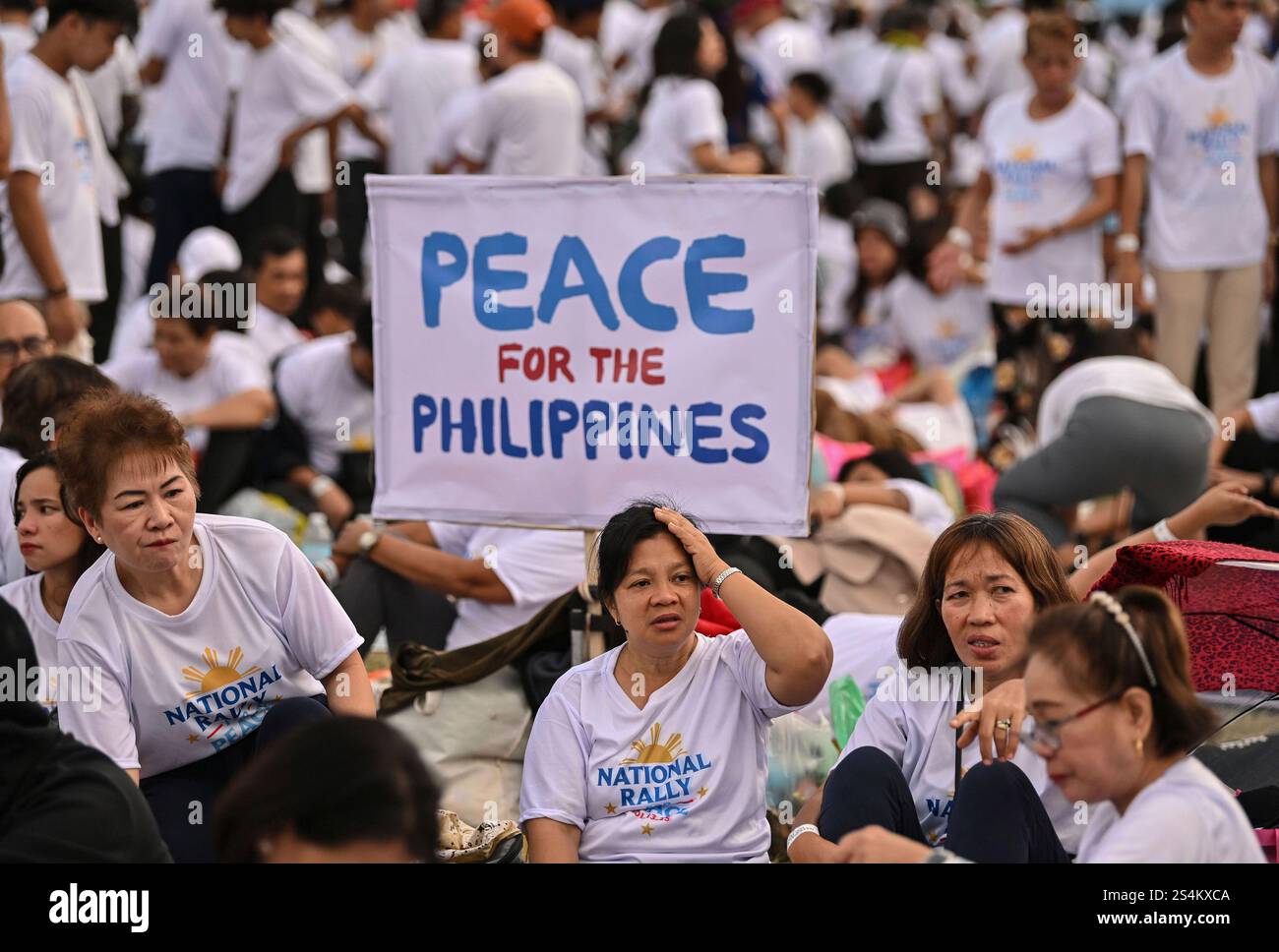 Participants rest during the National Rally for Peace organized by a ...