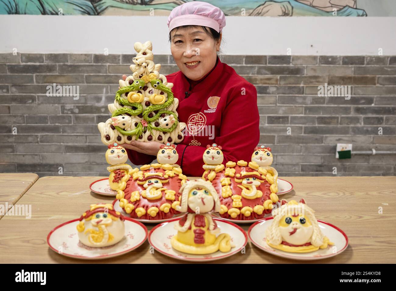 Taiyuan,China.10th January 2025. A folk artist makes Chinese snake ...