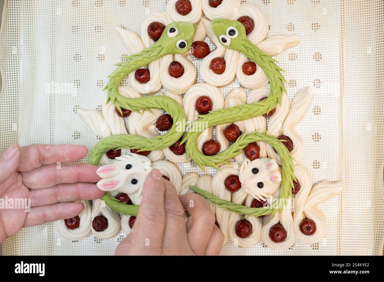 Taiyuan,China.10th January 2025. A folk artist makes Chinese snake ...