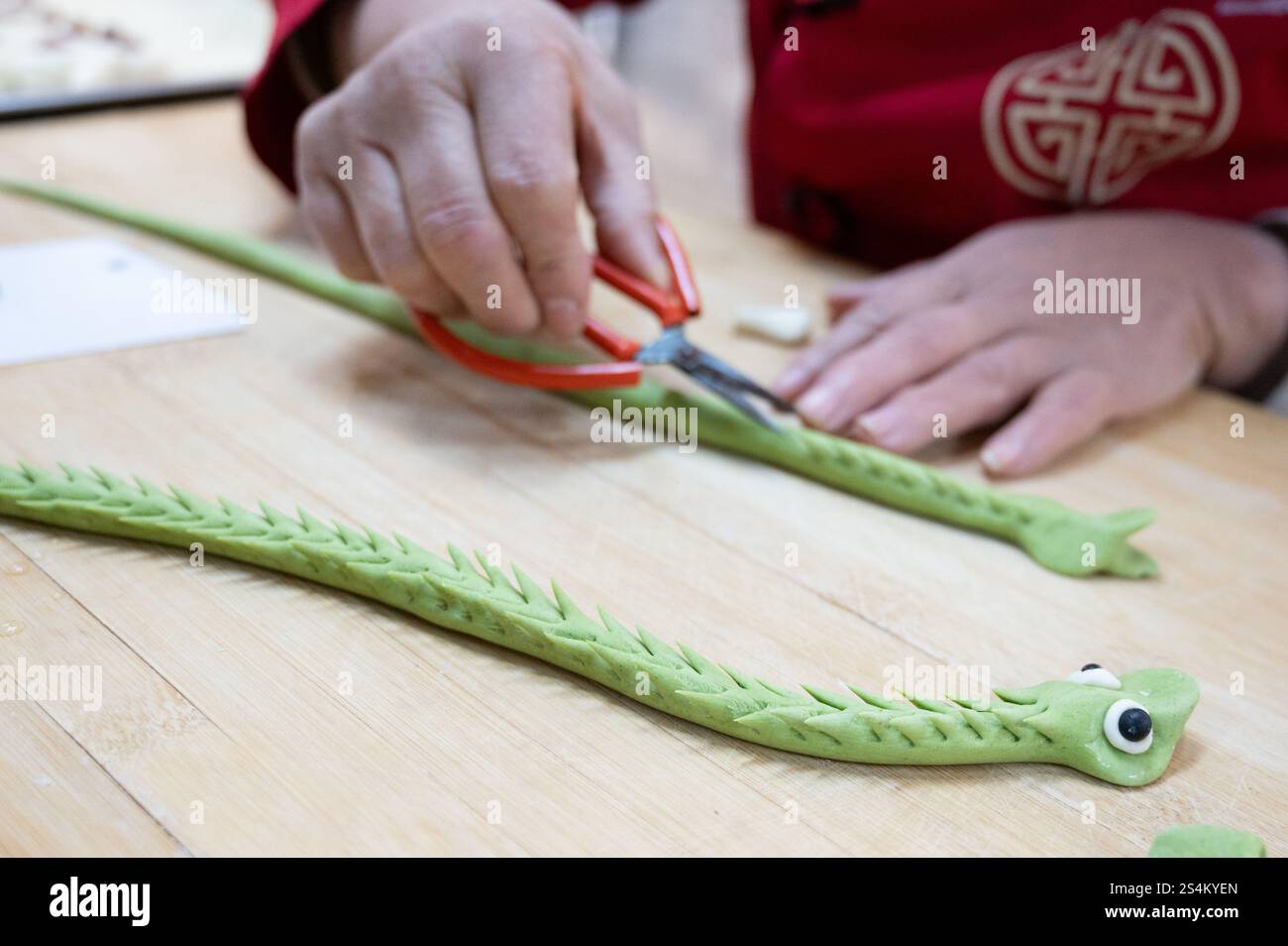 Taiyuan,China.10th January 2025. A folk artist makes Chinese snake ...